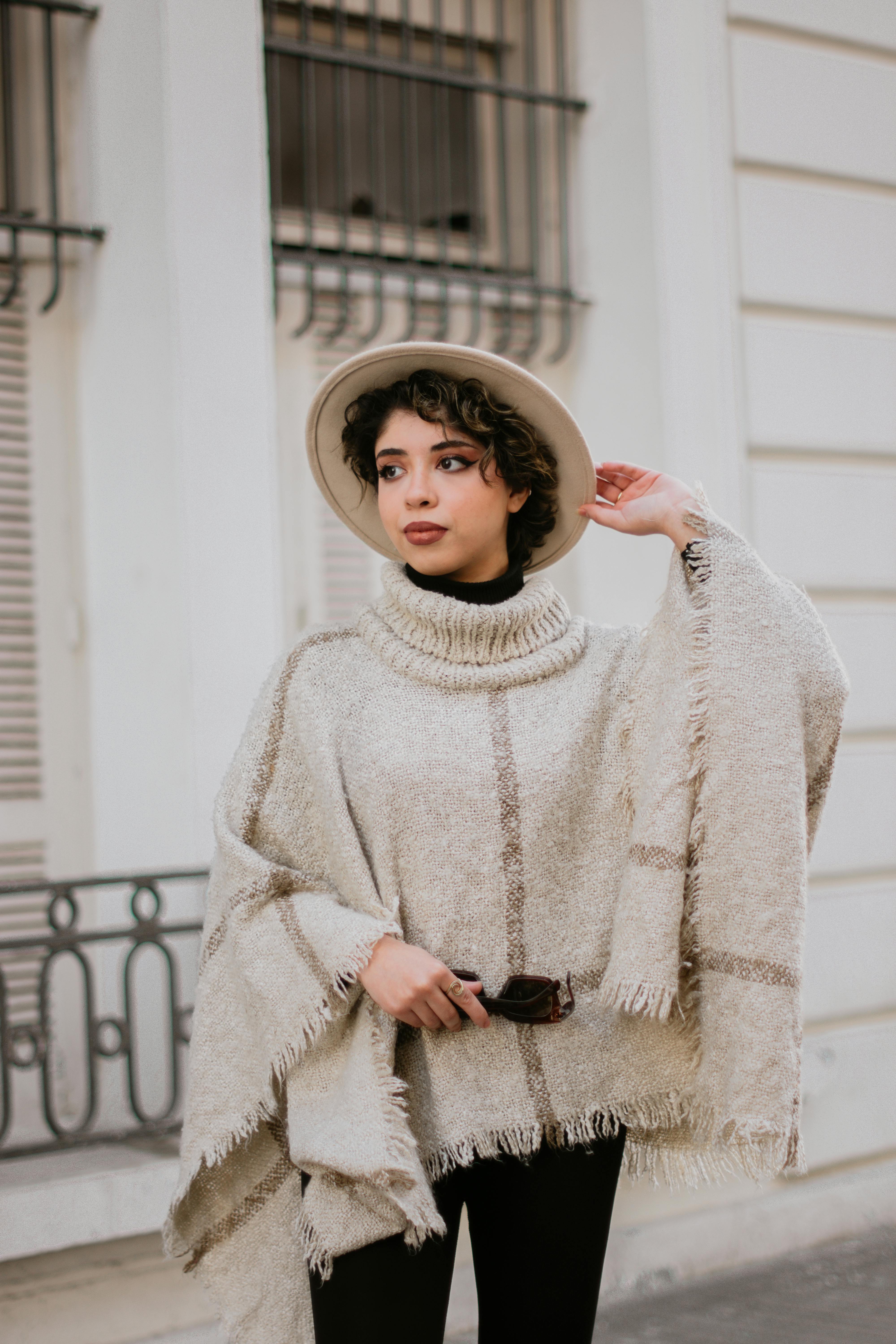 Woman Wearing White Poncho on a Street · Free Stock Photo