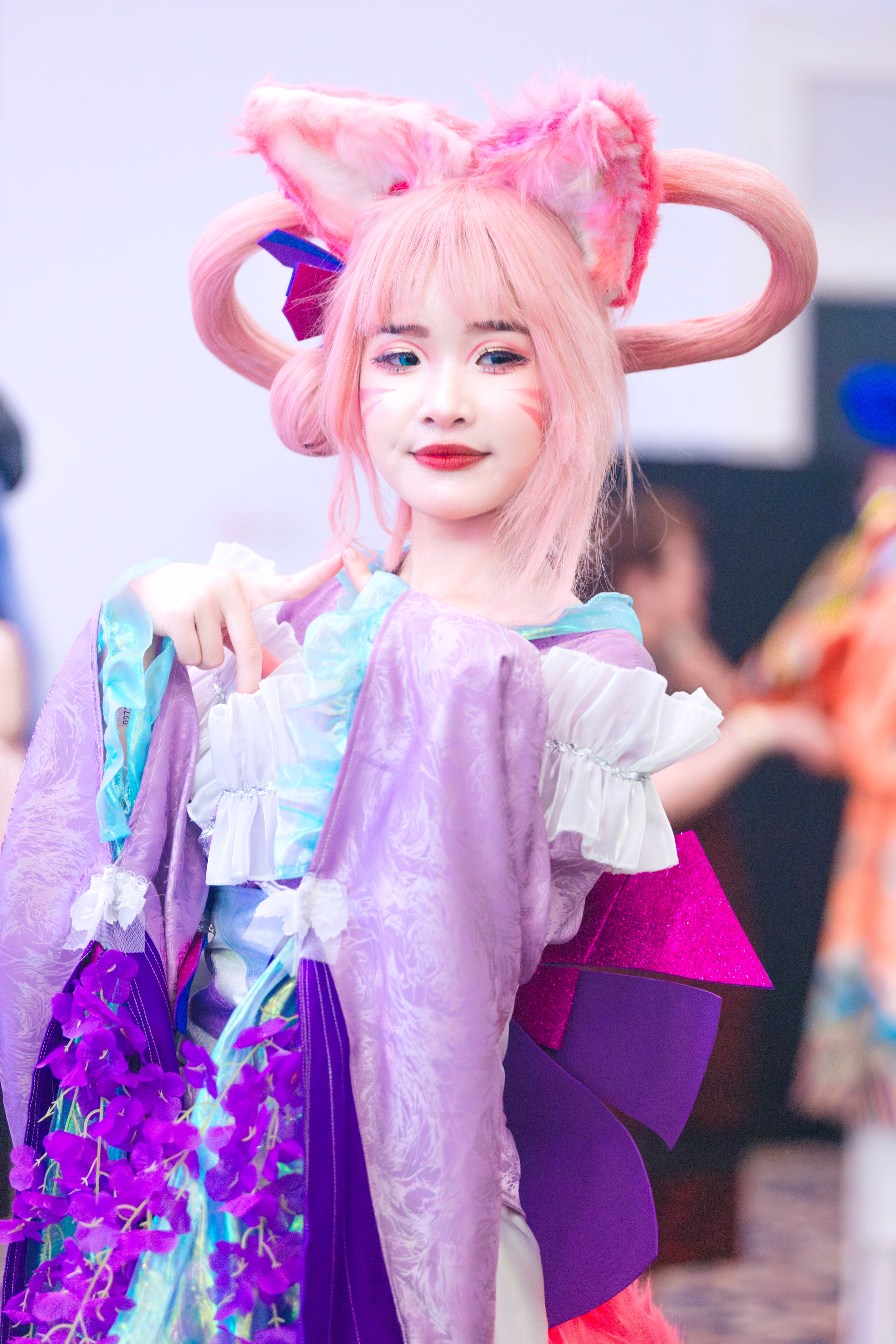 Cosplayer in a Costume with Cat Ears and Pink Hair · Free Stock Photo