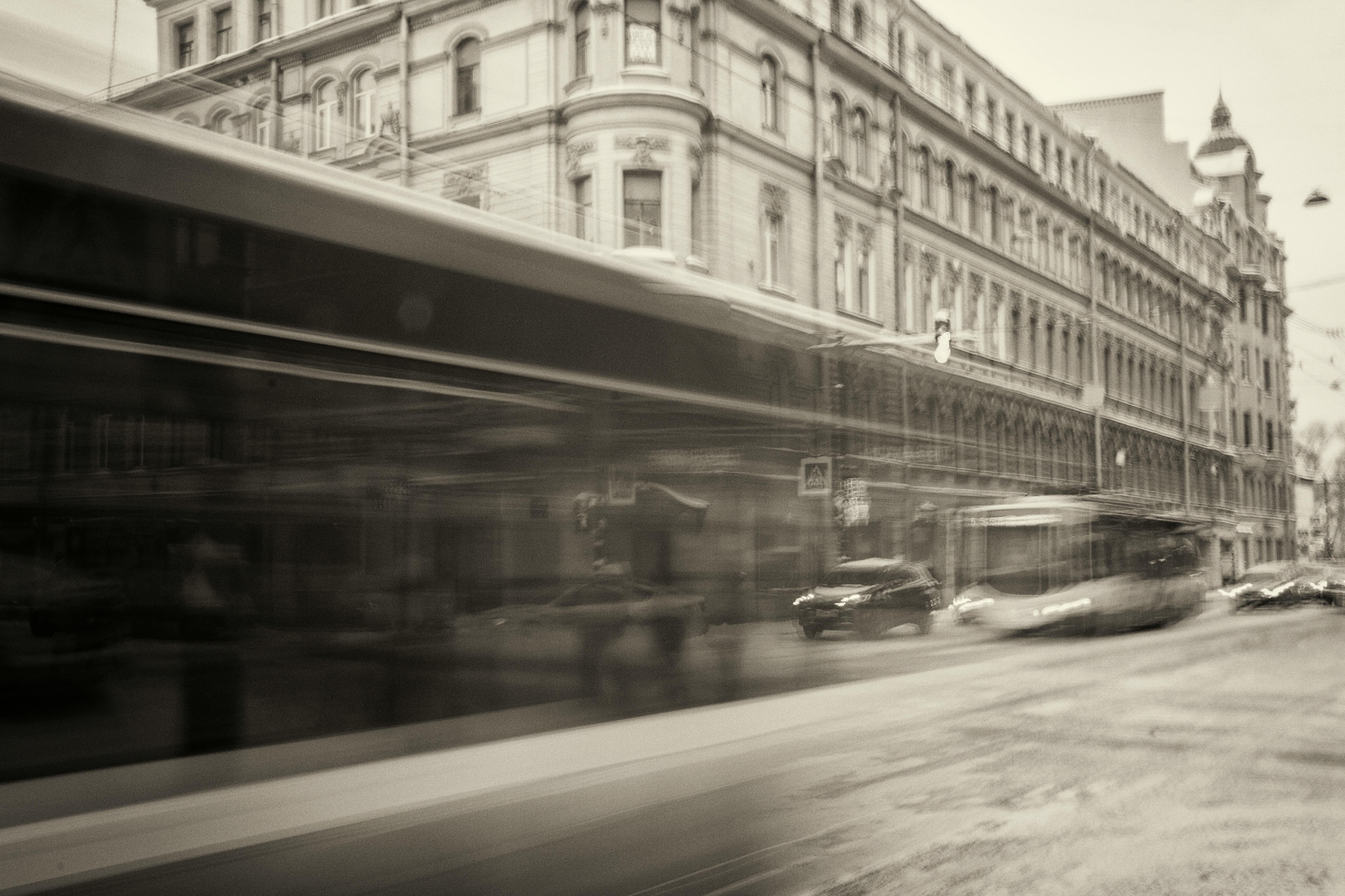 Grayscale View of City With Vehicles Passing Through · Free Stock Photo