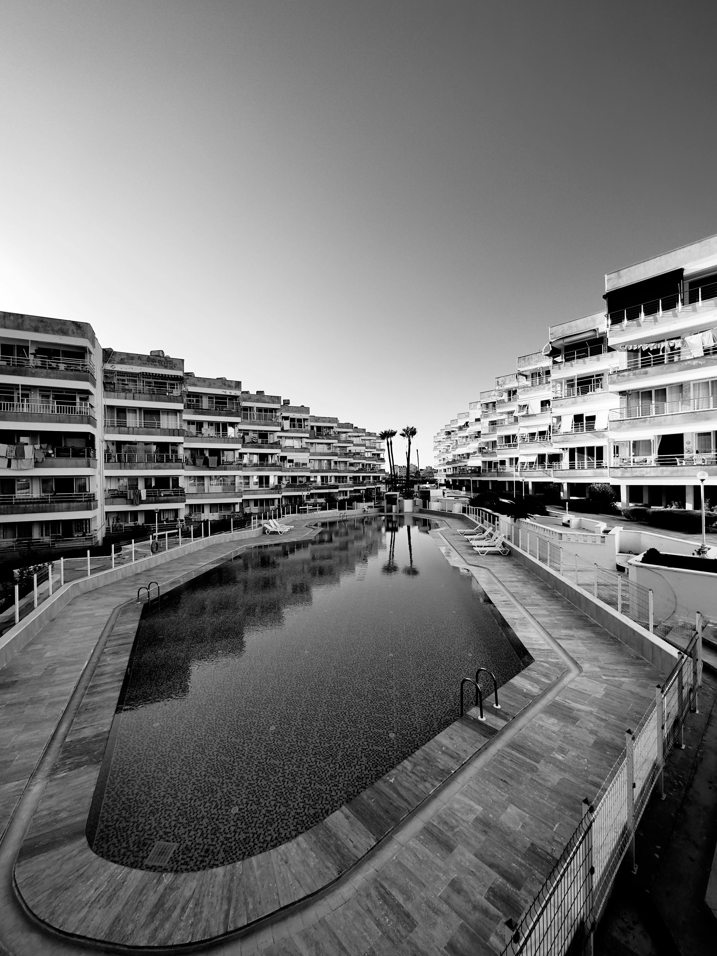 Pool Between Apartment Buildings in Town · Free Stock Photo