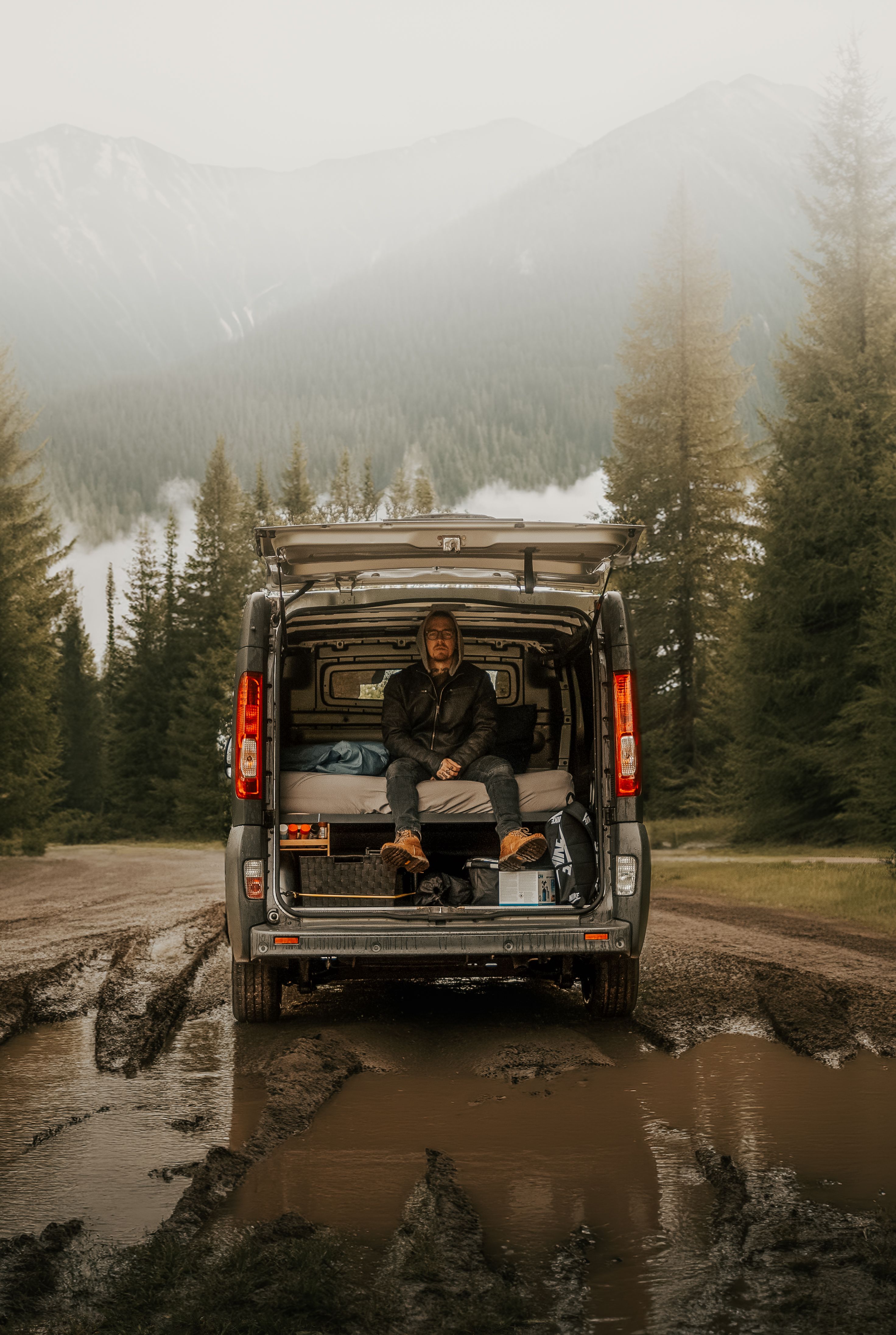 Man in a Van in a Mountain Valley · Free Stock Photo