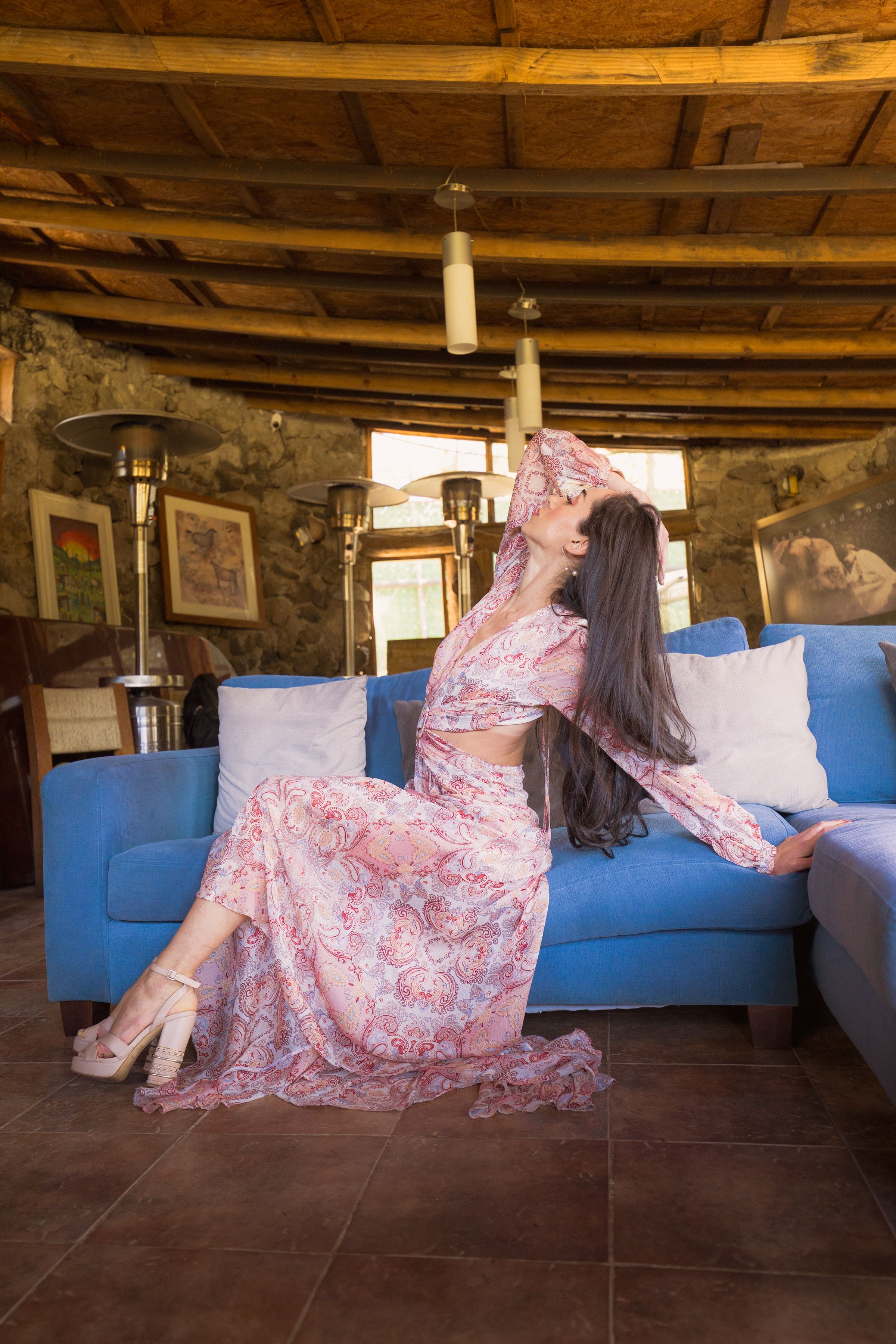 Woman in Dress and High Heels Sitting on Couch · Free Stock Photo