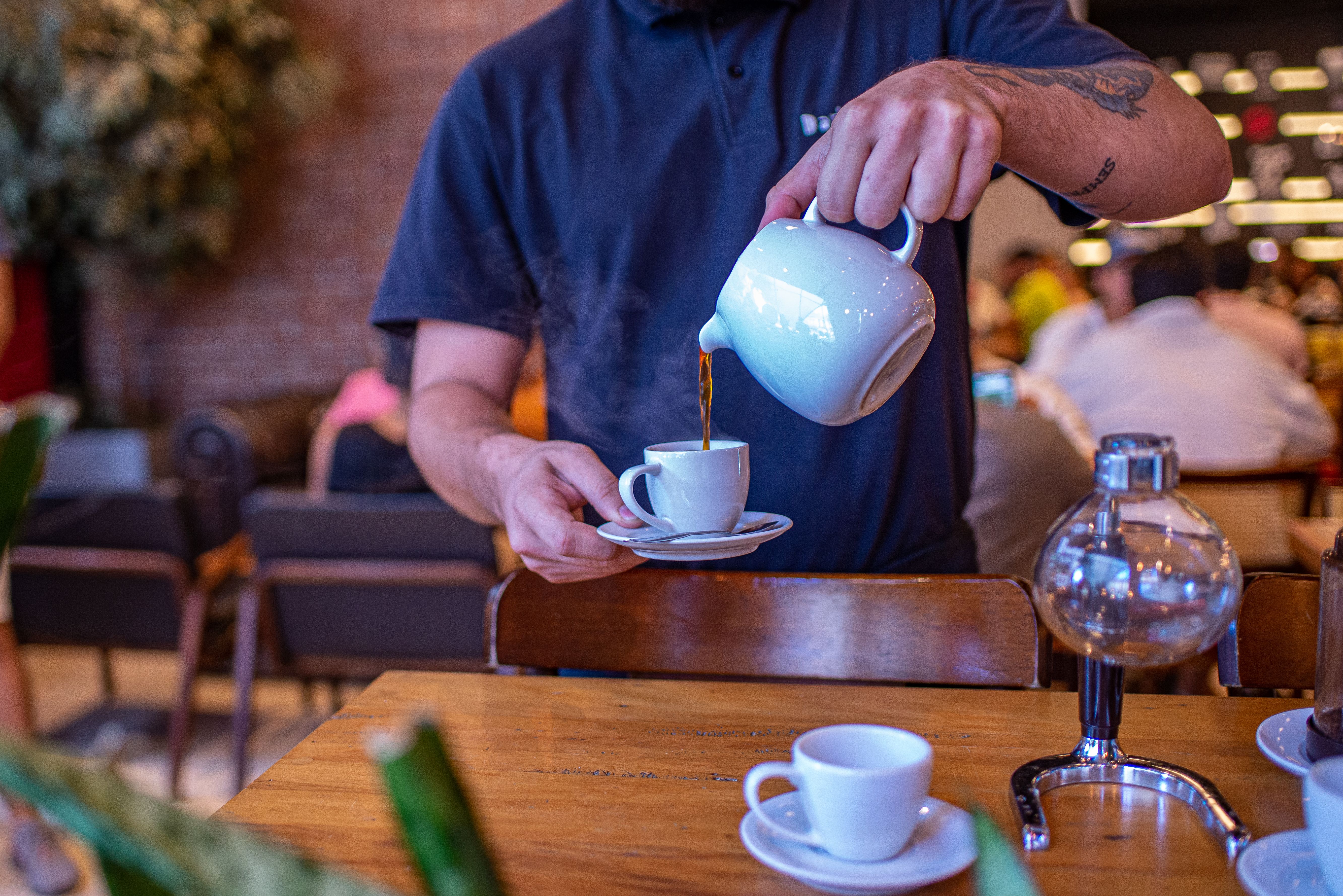 Man Pouring Hot Tea to Cup · Free Stock Photo