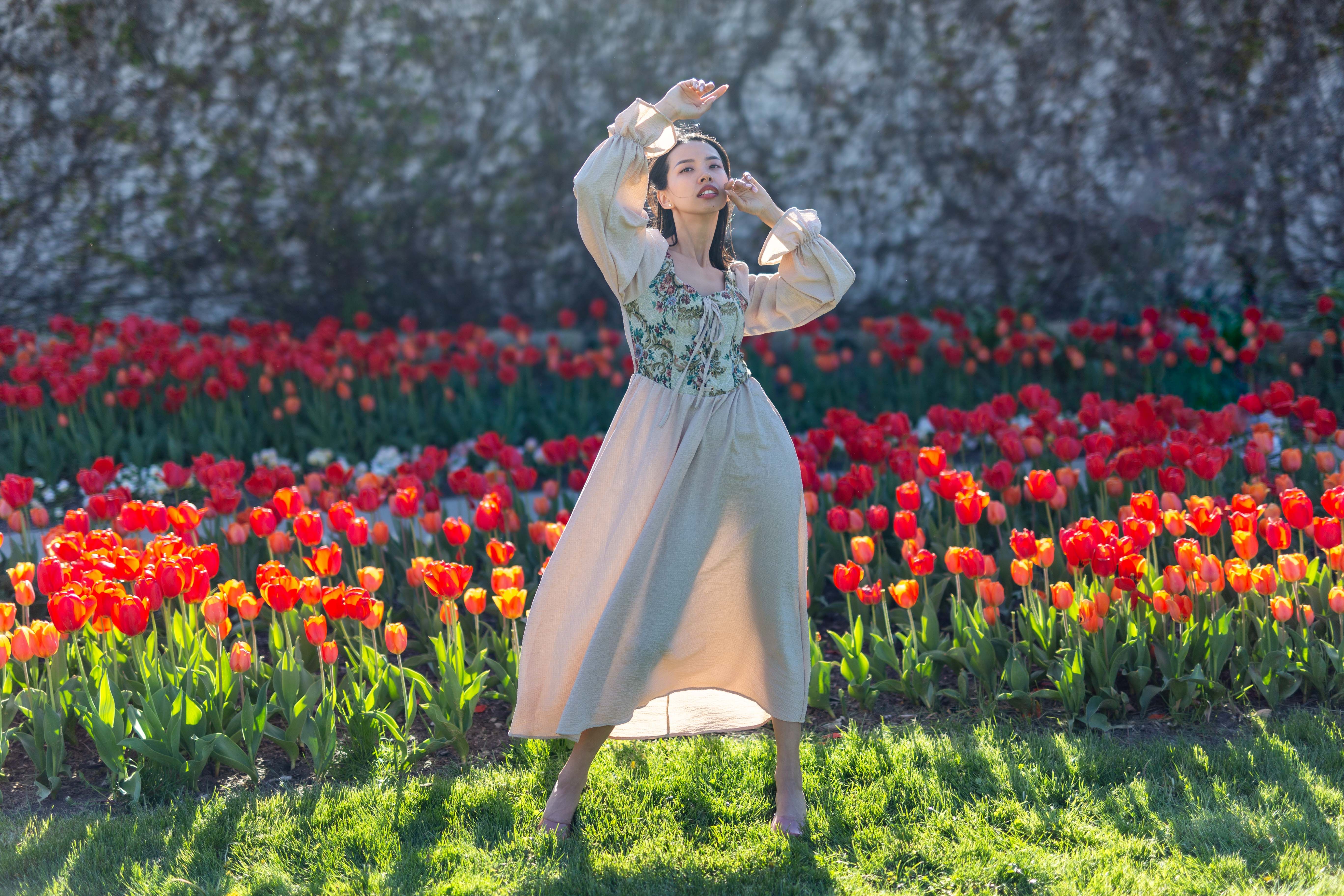 Woman in Sundress Standing by Tulips Field · Free Stock Photo