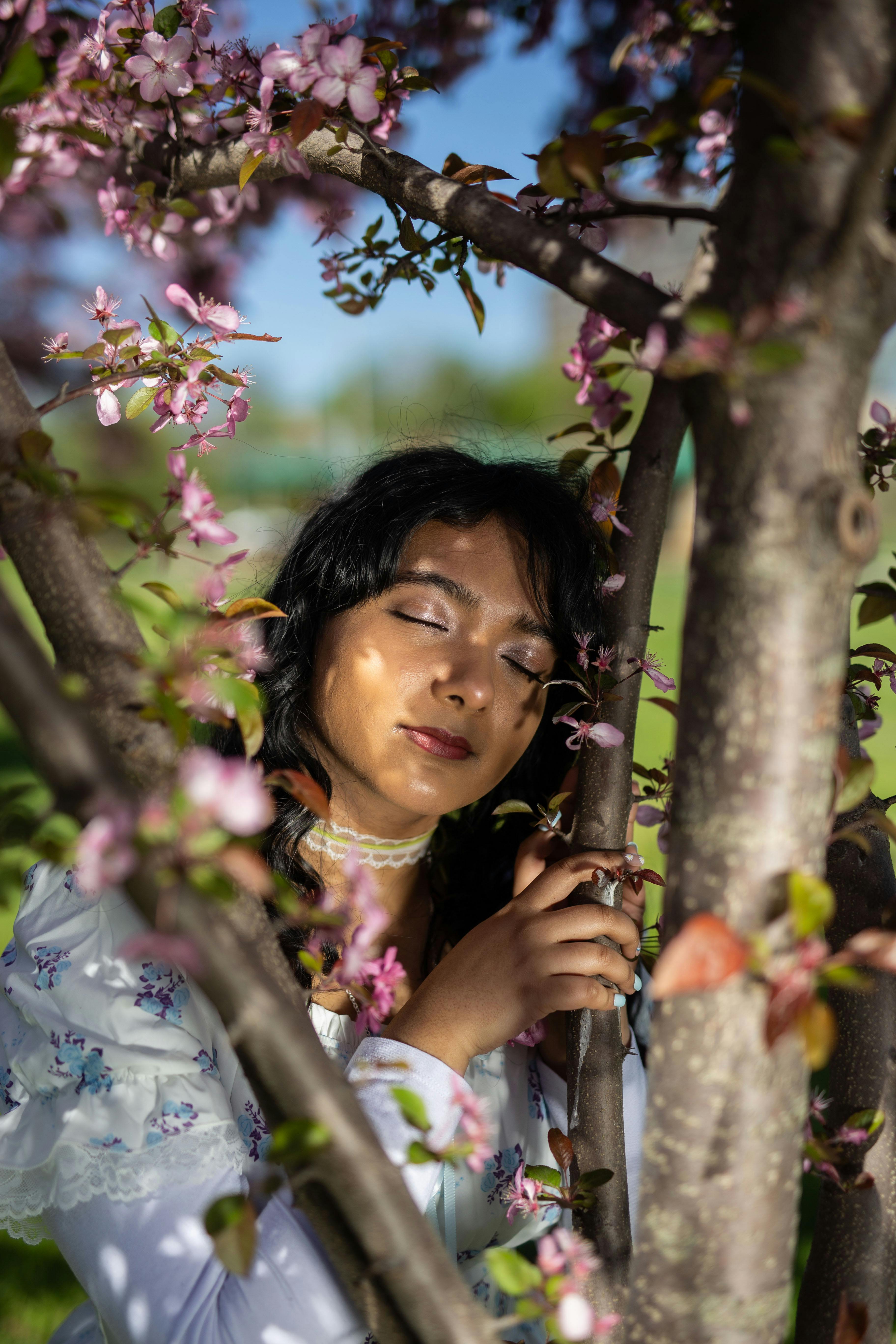 Woman Relaxing Hugging a Cherry Tree · Free Stock Photo