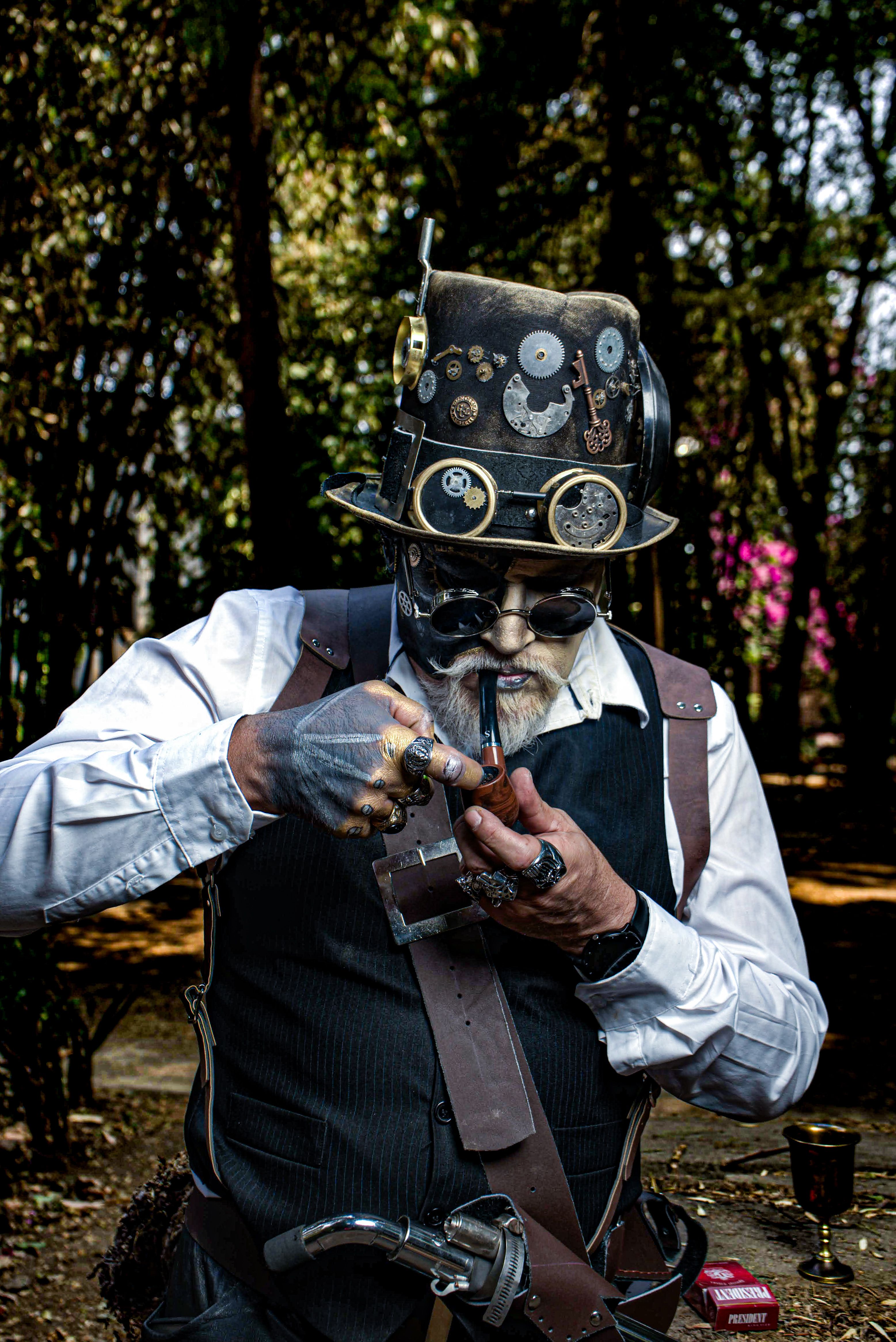 Steampunk Style Man Lighting Pipe · Free Stock Photo