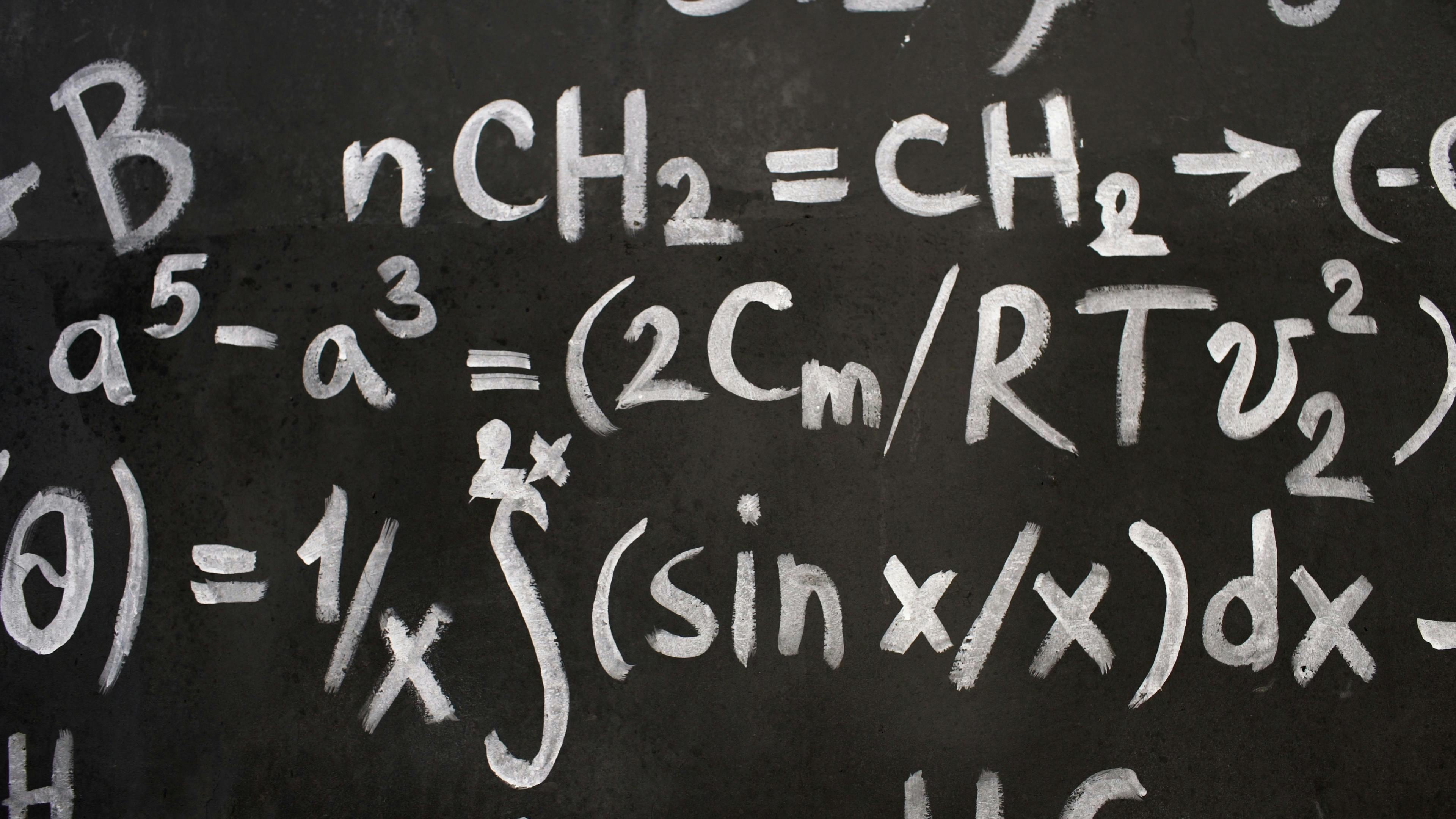 A blackboard with math formulas written on it · Free Stock Photo