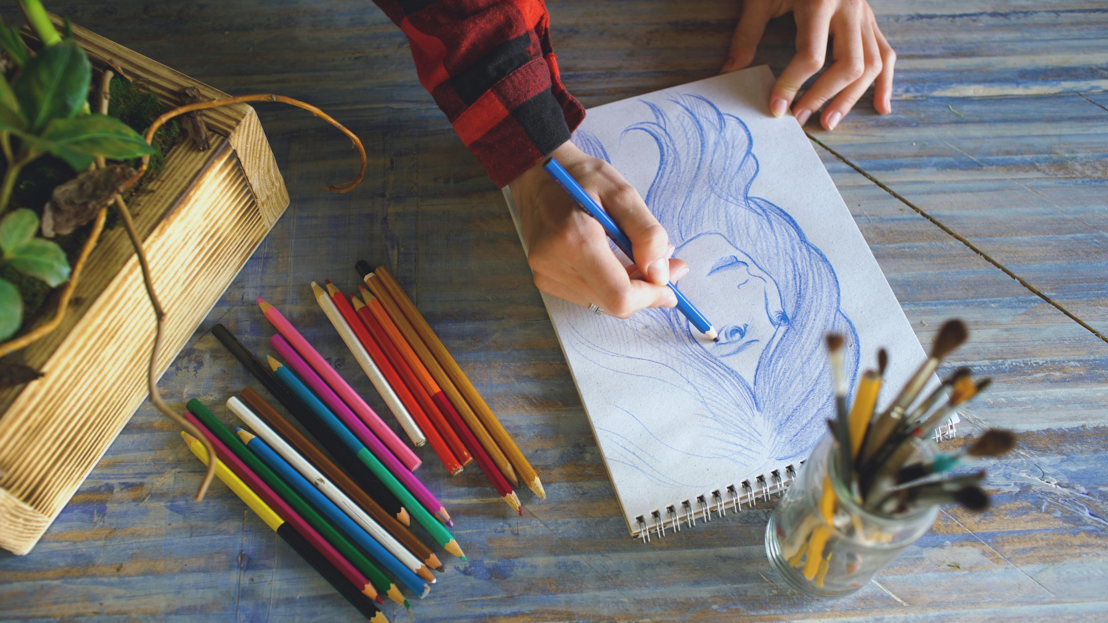 Person Drawing with Color Pencils · Free Stock Photo