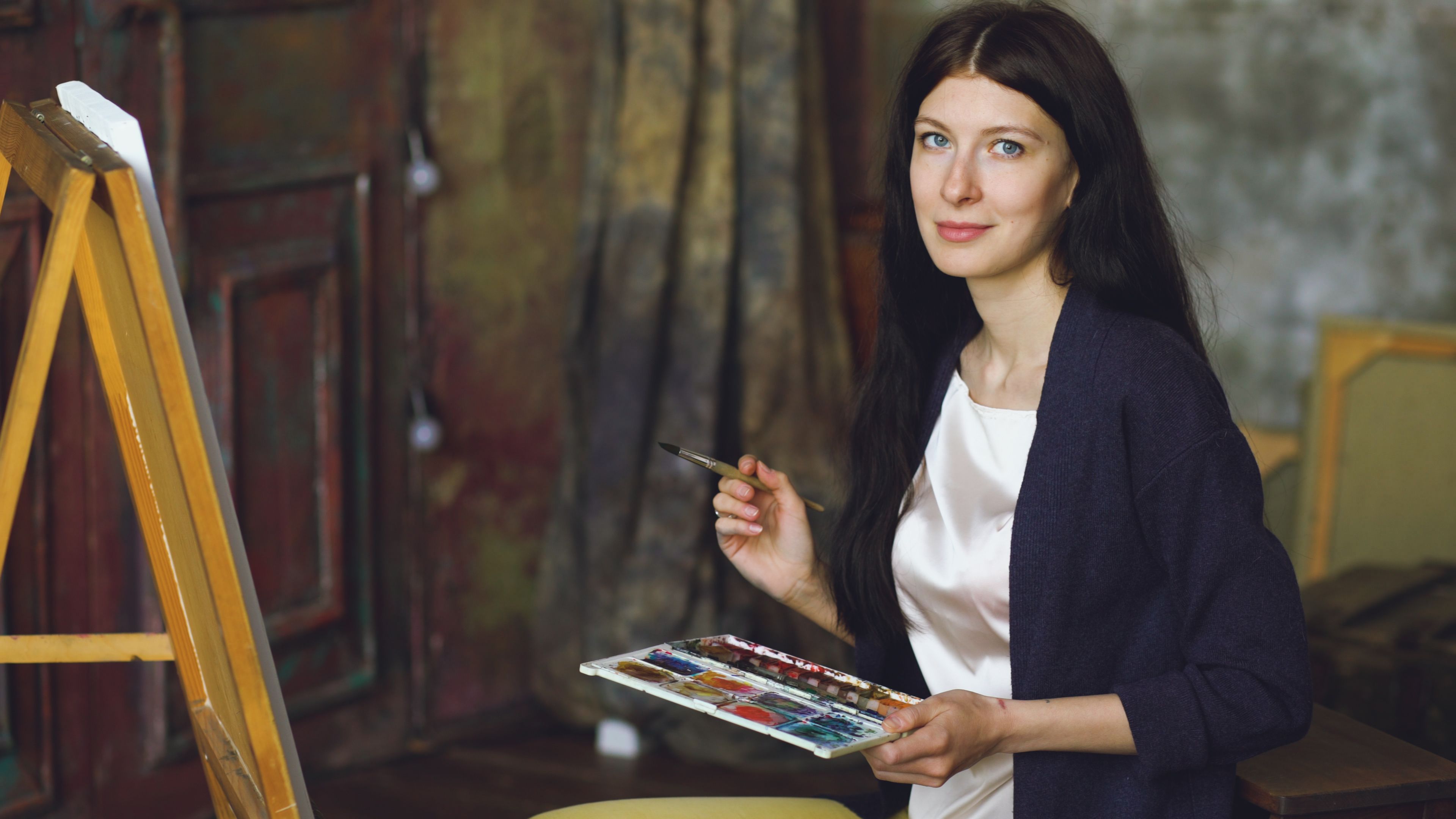Woman Painting on Canvas with Watercolor Paints · Free Stock Photo