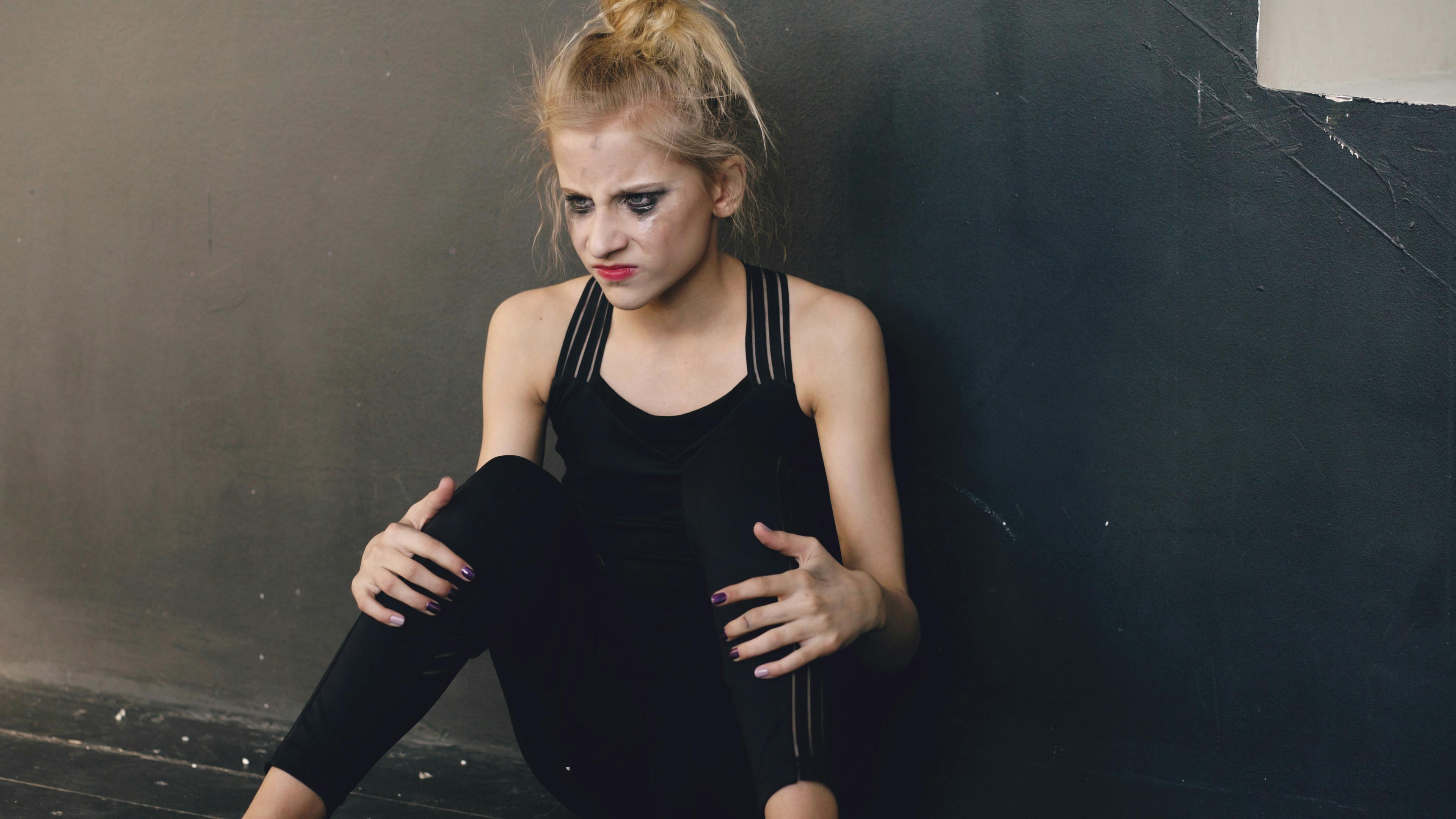 Girl Dancer in Black Jogging Outfit Sitting and Crying with Makeup ...