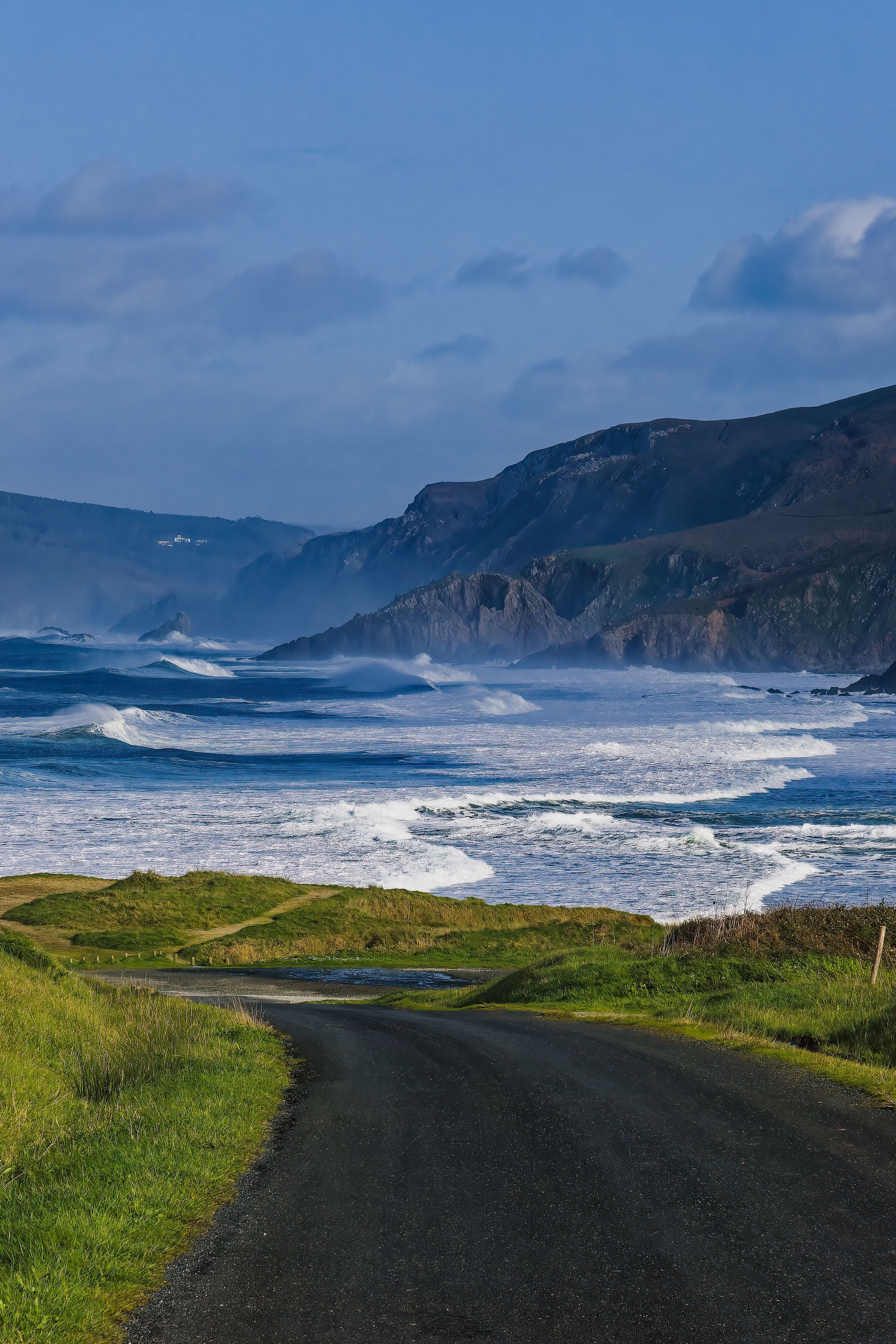 Waves on Ocean Shore Seen From Road · Free Stock Photo
