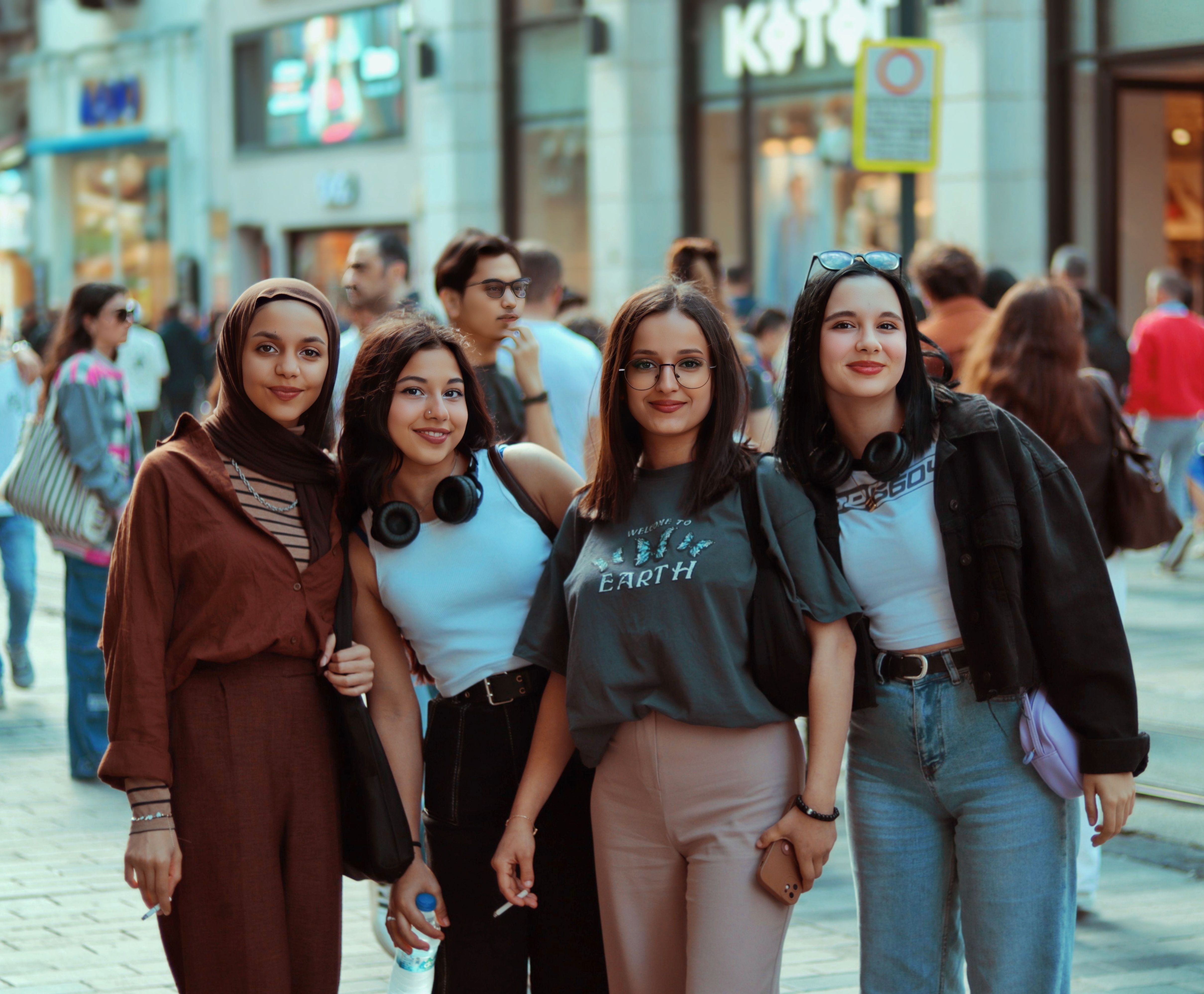Four women standing on a street with a man · Free Stock Photo