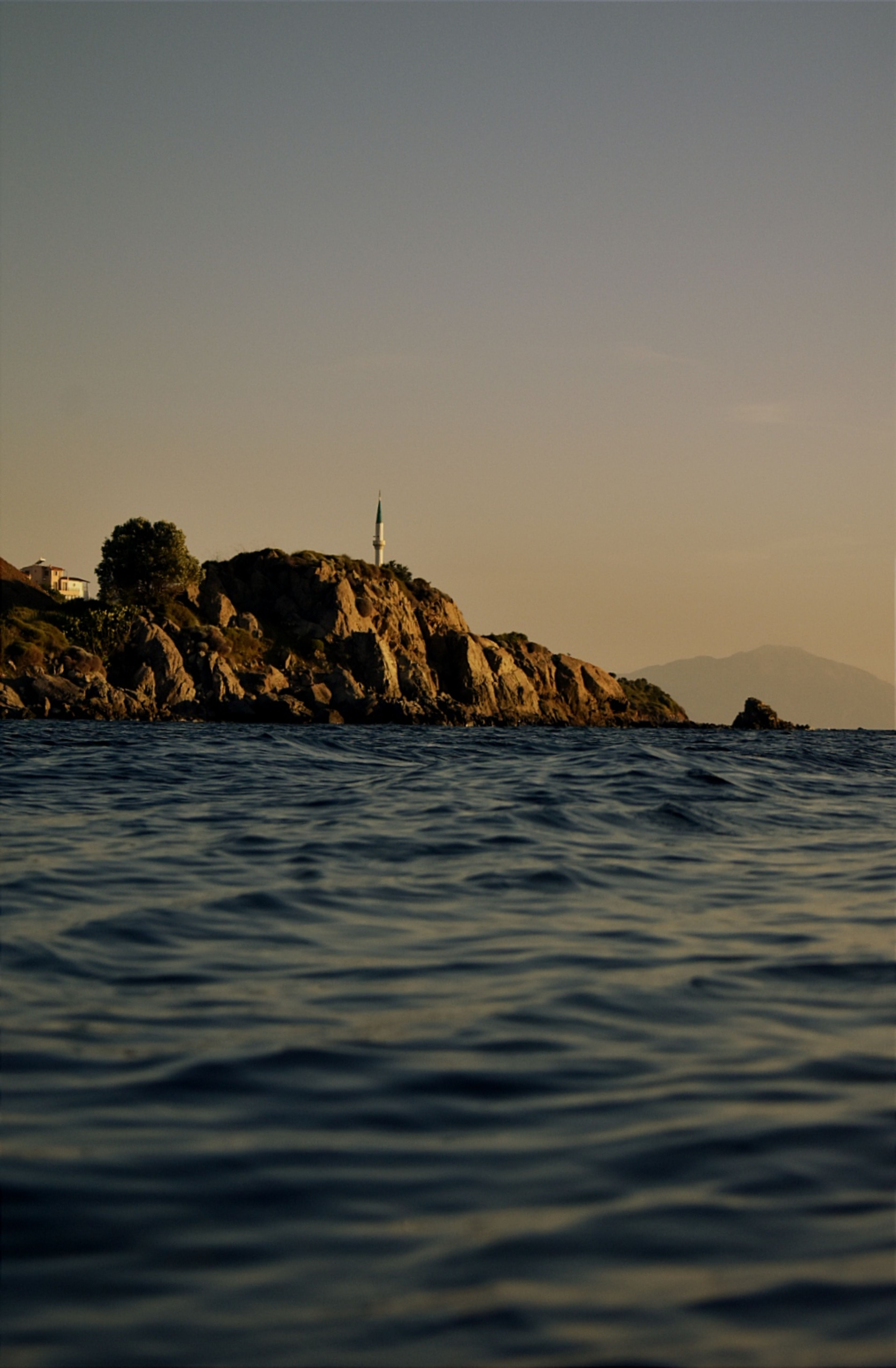 Rocks and Minaret on Sea Shore · Free Stock Photo
