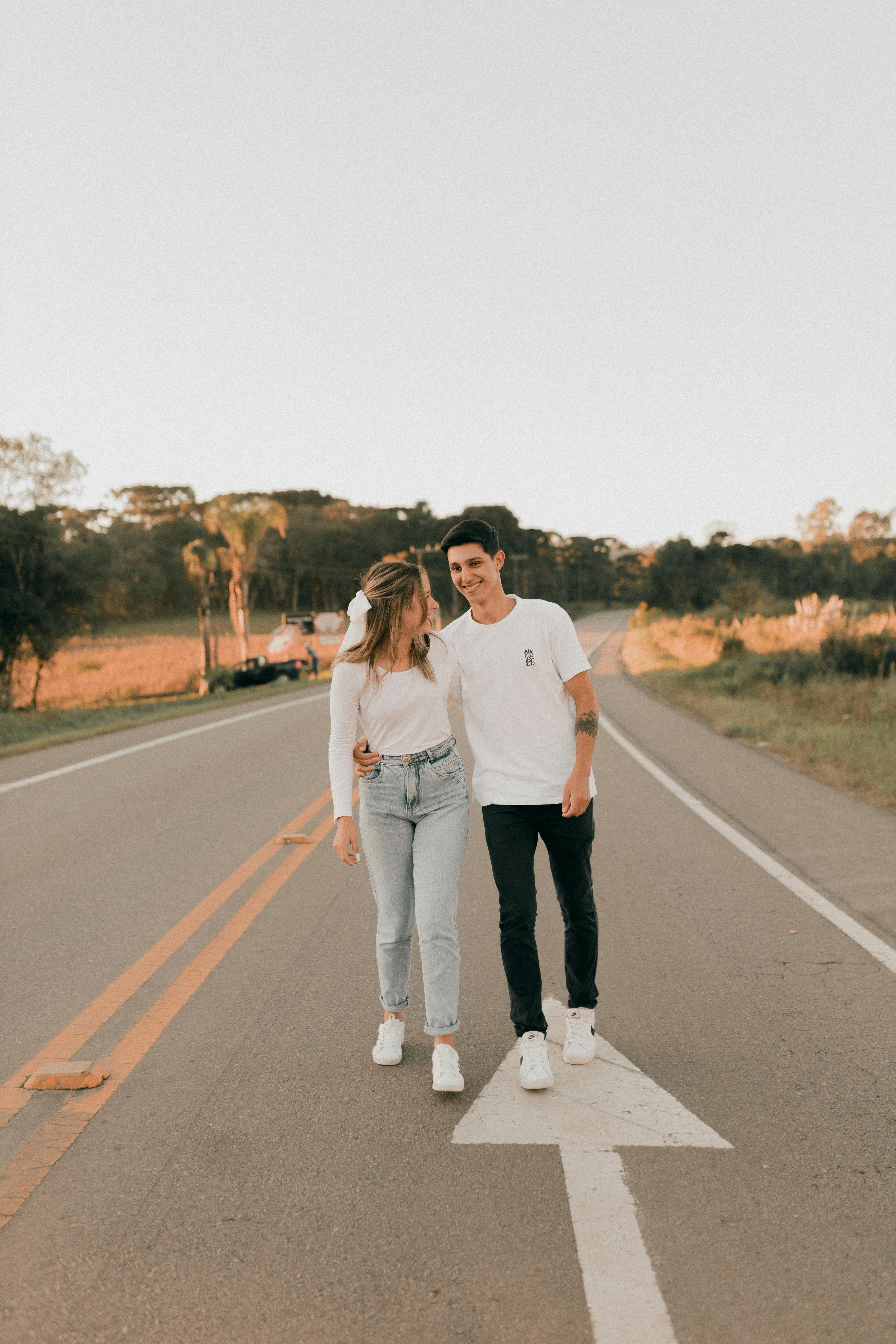 Couple Walking on a Road · Free Stock Photo