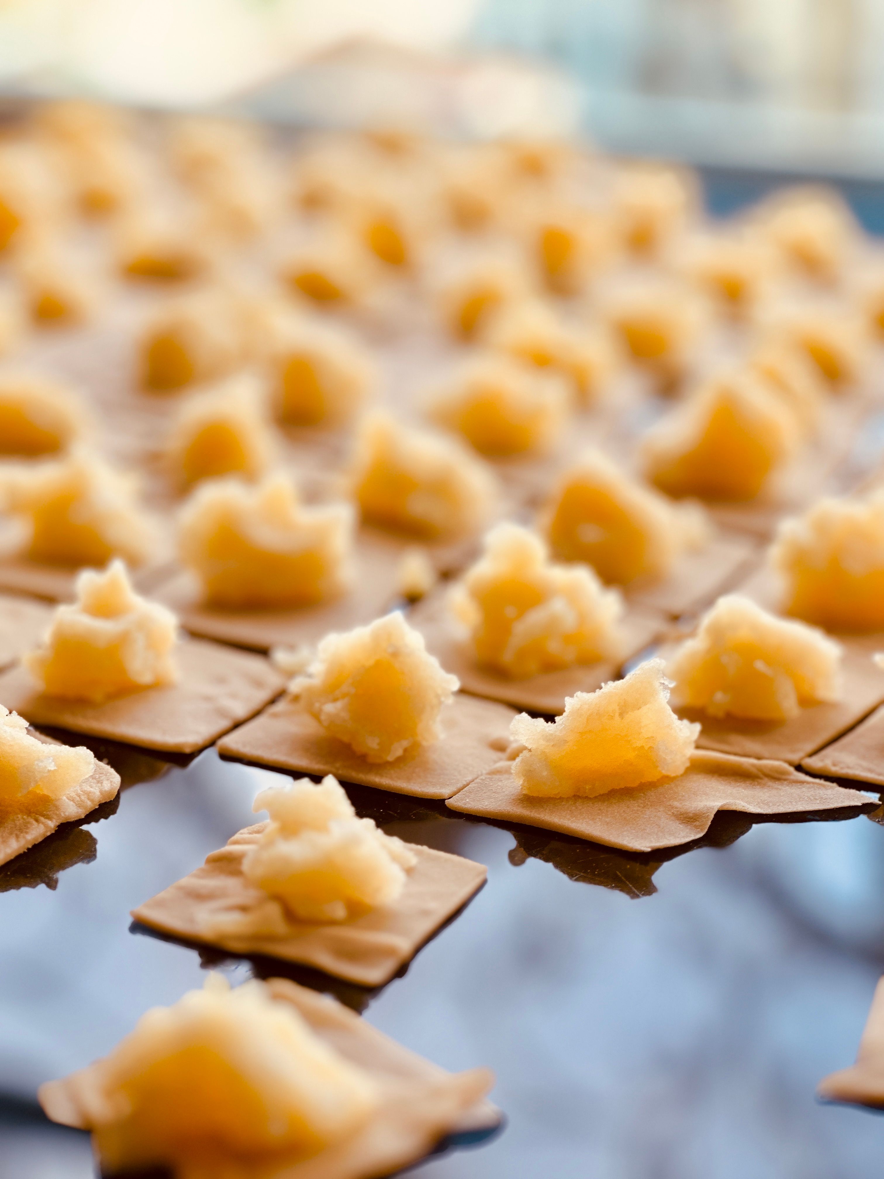 A tray of crackers with butter on top · Free Stock Photo