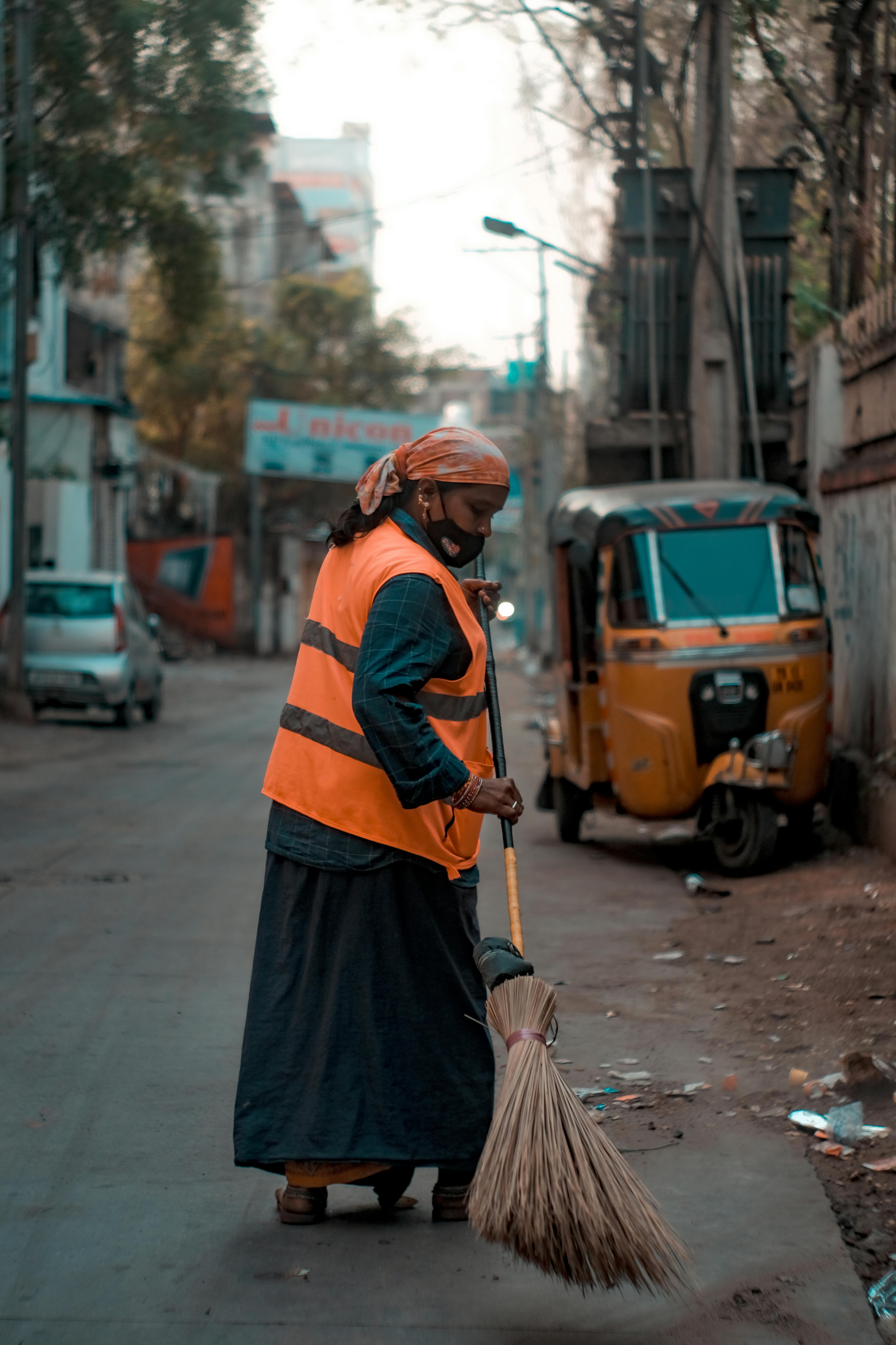 Woman Cleaning Street · Free Stock Photo