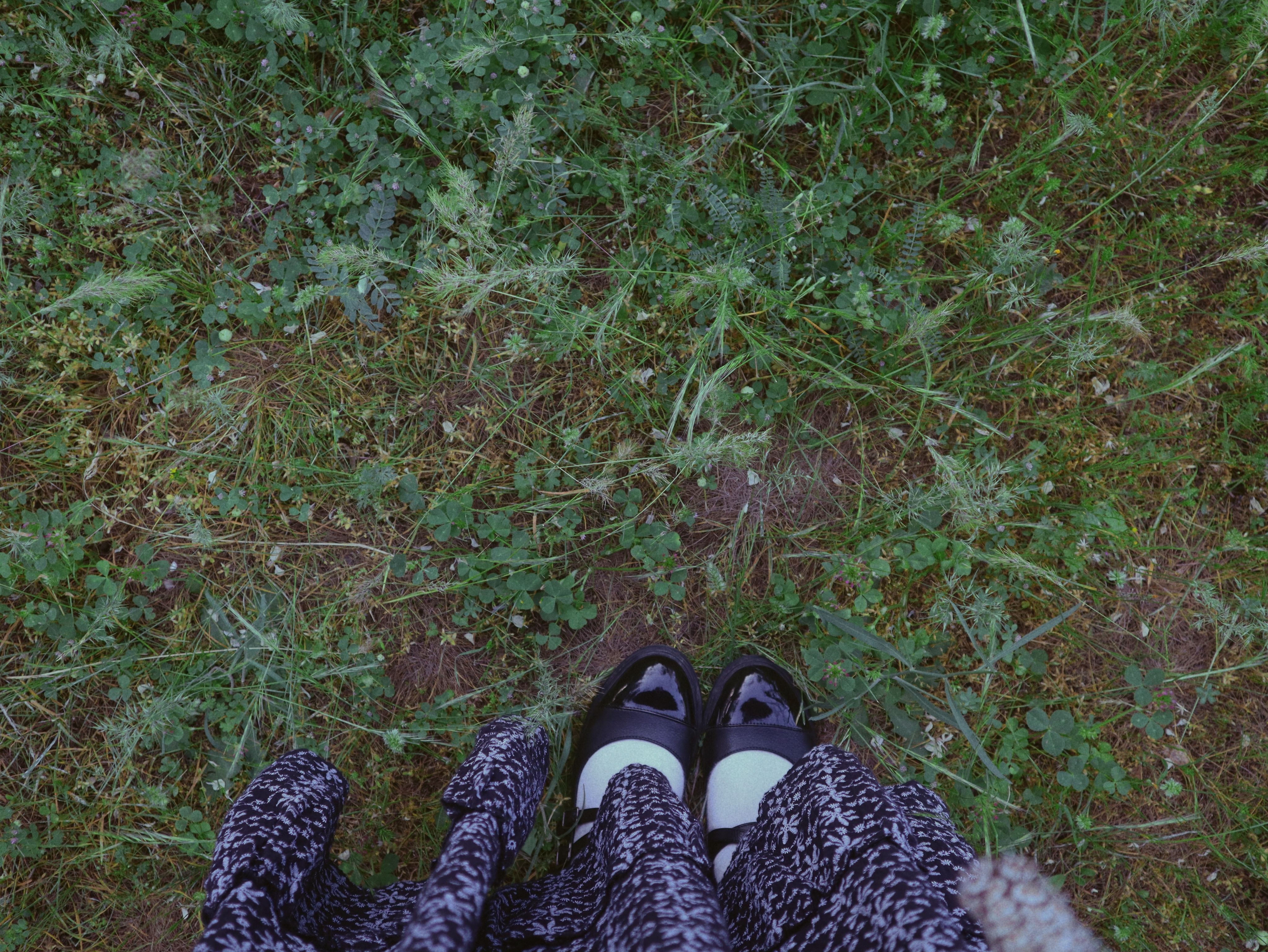 First Person Perspective Shot of a Woman in a Dress Standing on the ...