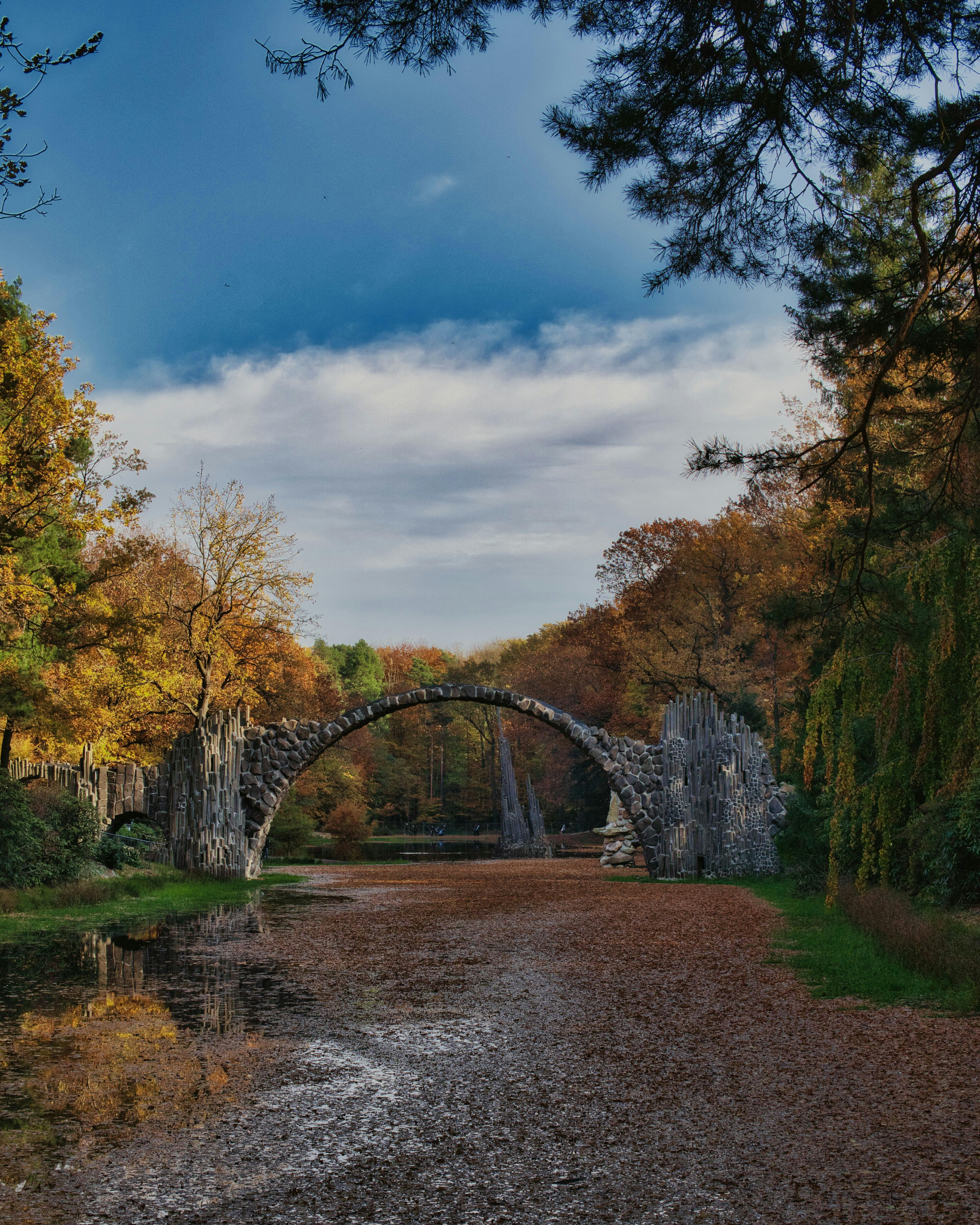 Circular Bridge over River with Leaves in The Kromlau Azalea and ...