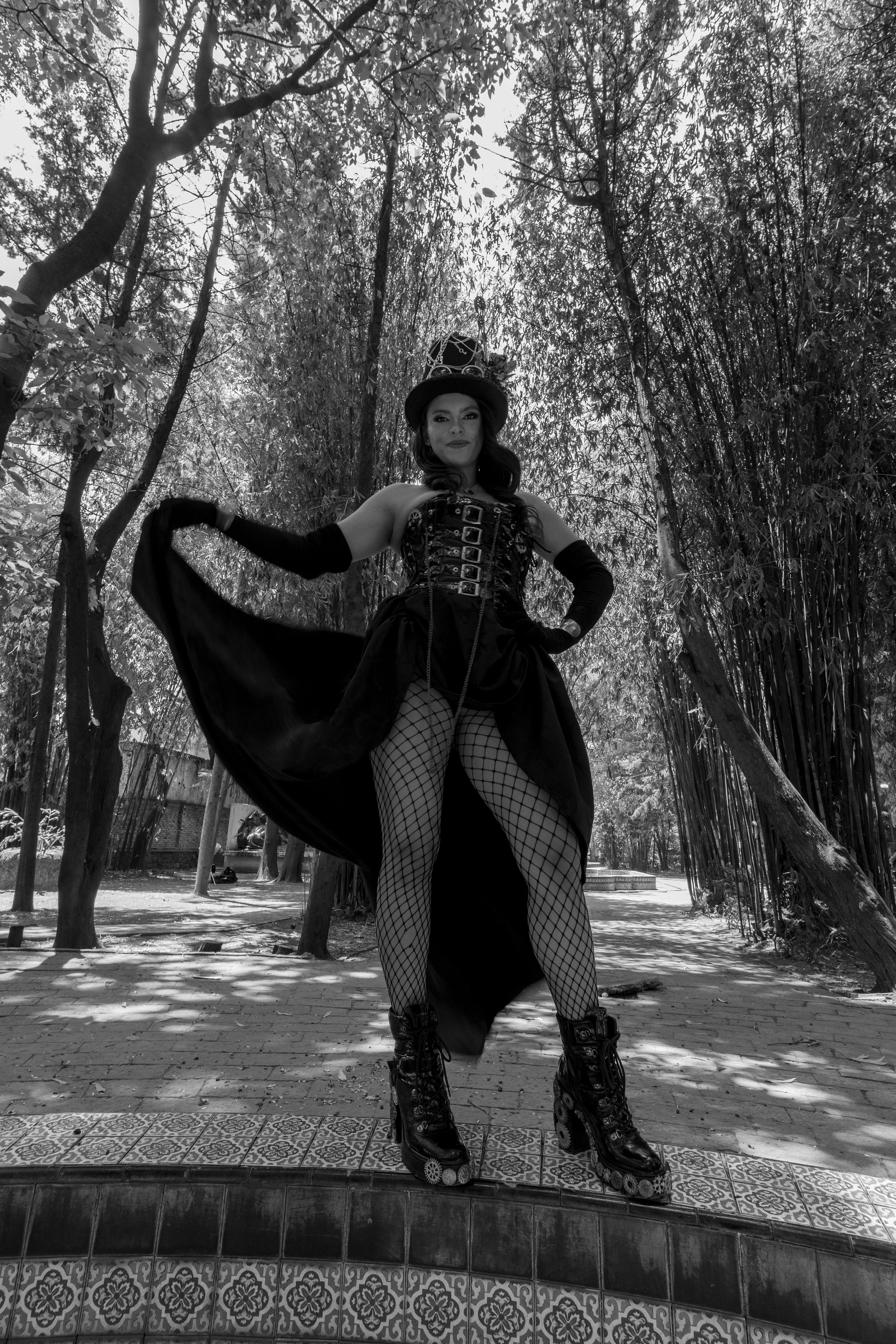 Woman Wearing Steampunk Dark Costume with Fishnets in Park with Trees ...