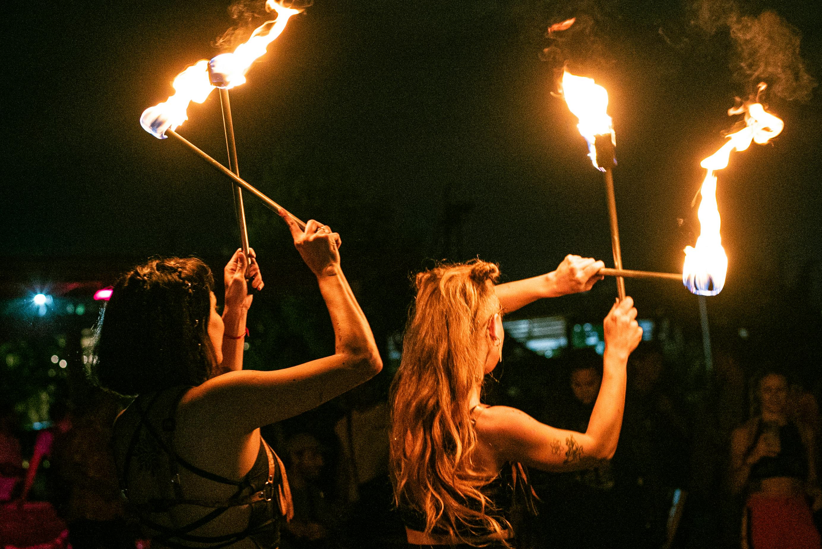 Women with Flames in the Dark · Free Stock Photo