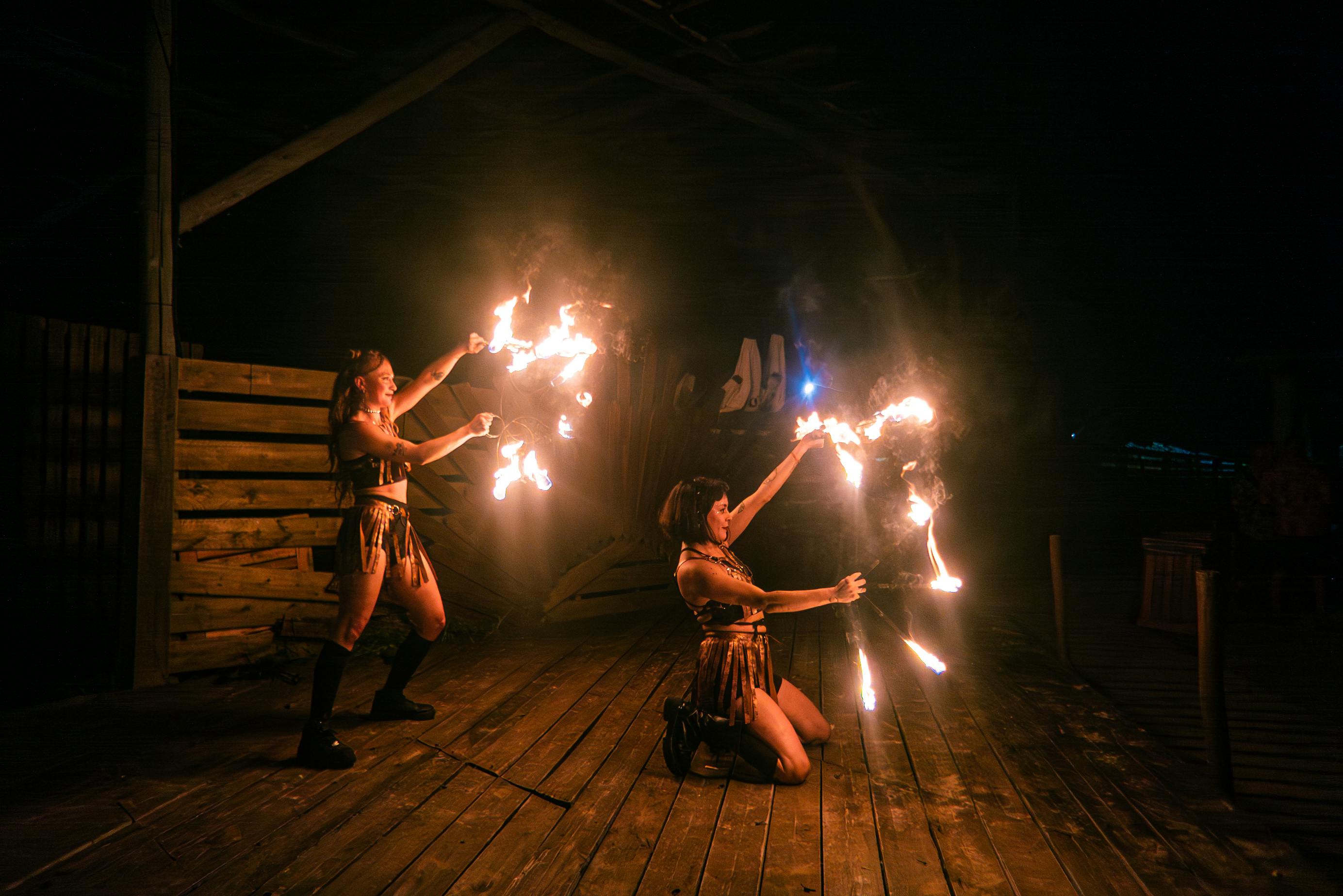 Women with Burning Torches on Stage · Free Stock Photo