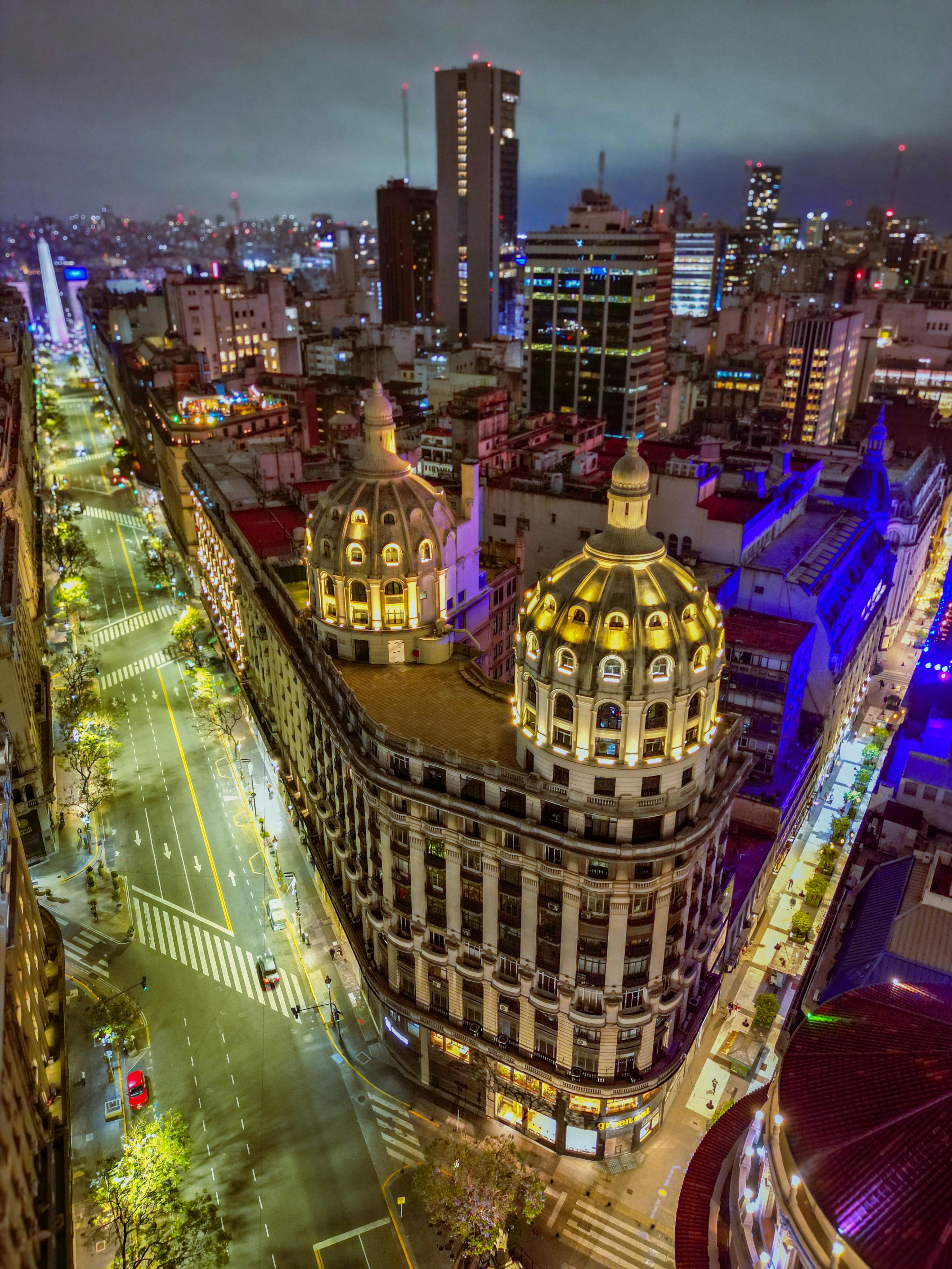 Aerial View of Edificio Bencich Building on Street Corner in Buenos Aires, Argentina at Night ...