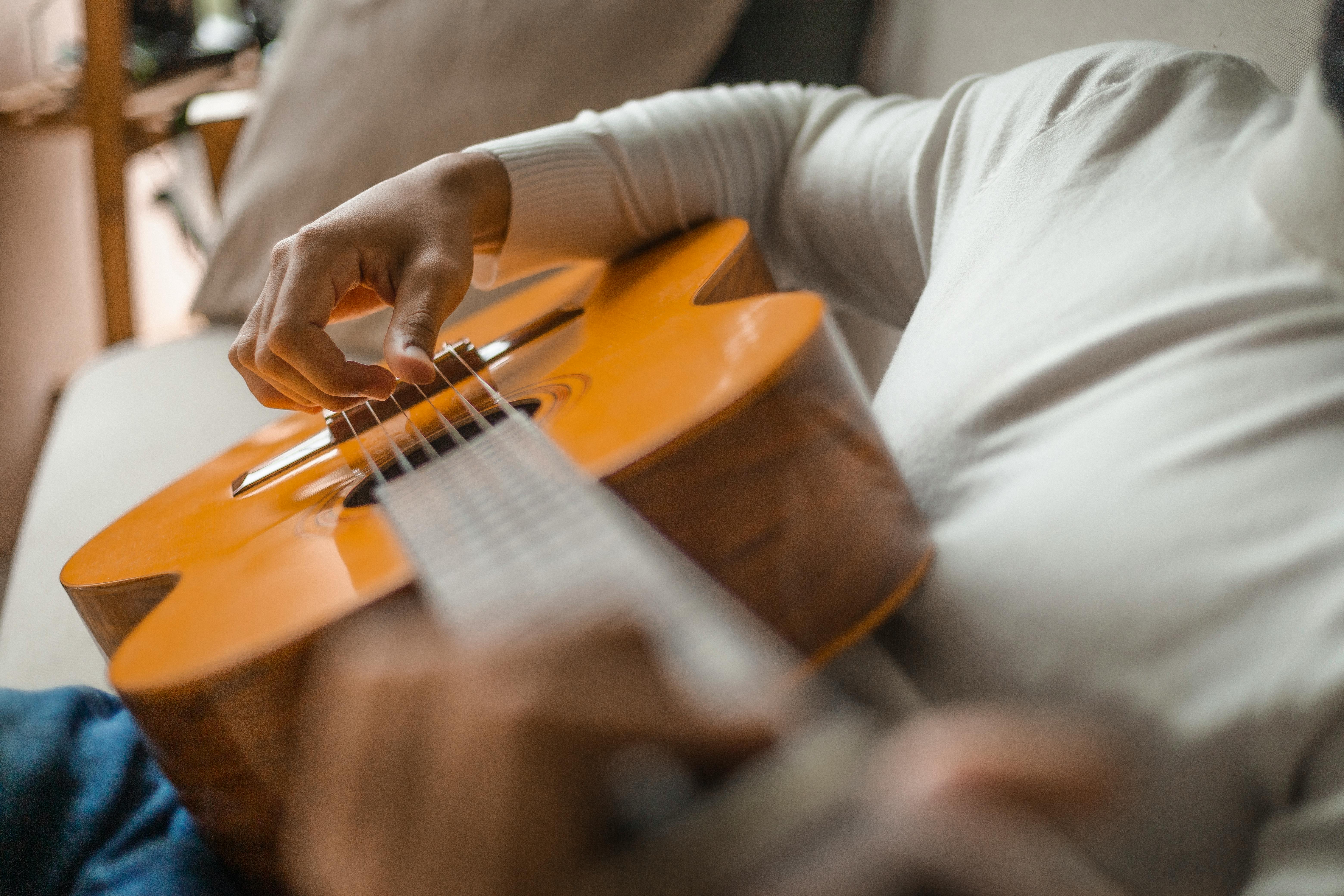 Person Playing Acoustic Guitar · Free Stock Photo