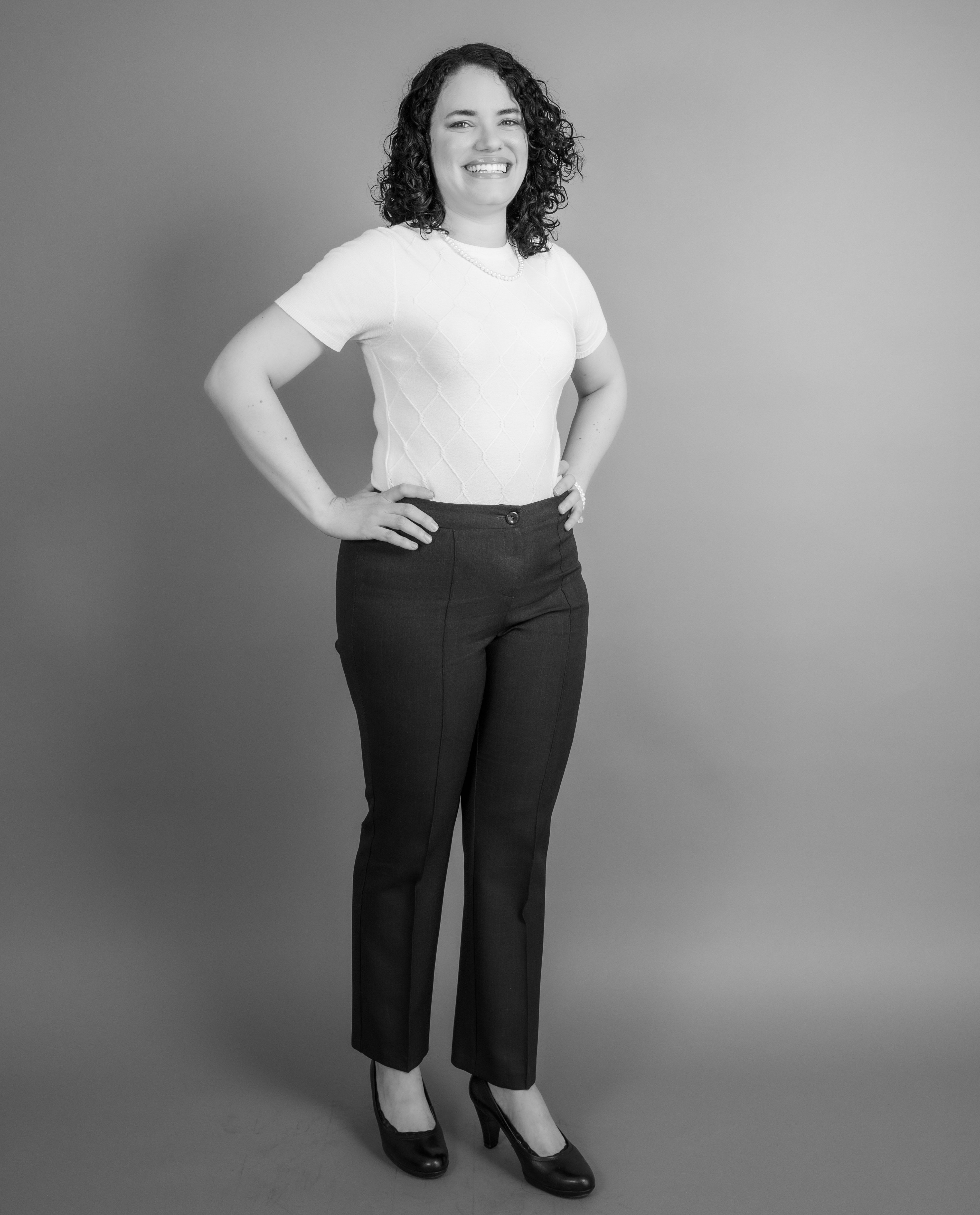 Woman Standing and Smiling · Free Stock Photo