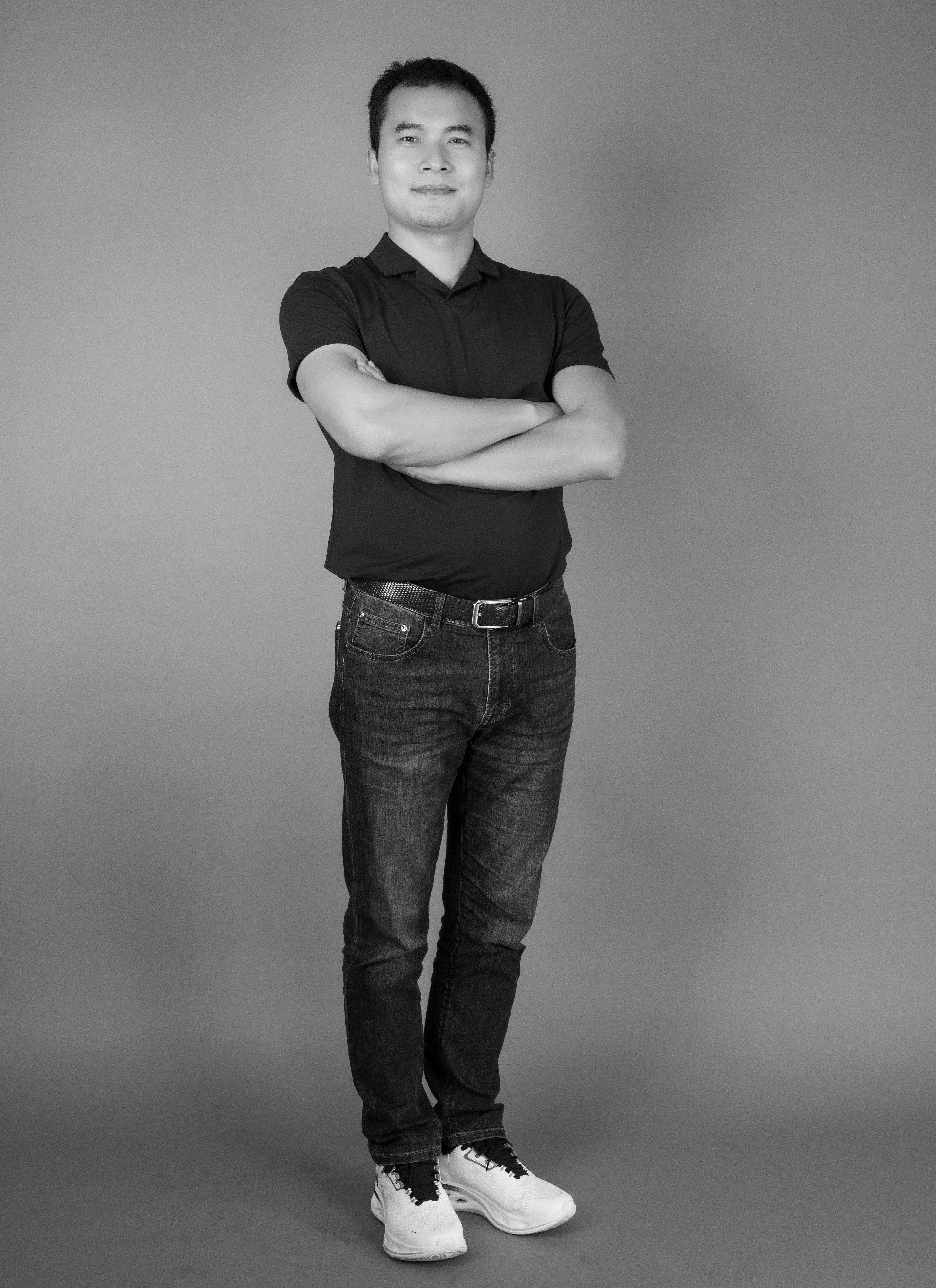 Studio Portrait of a Male Model Standing with Crossed Arms · Free Stock ...