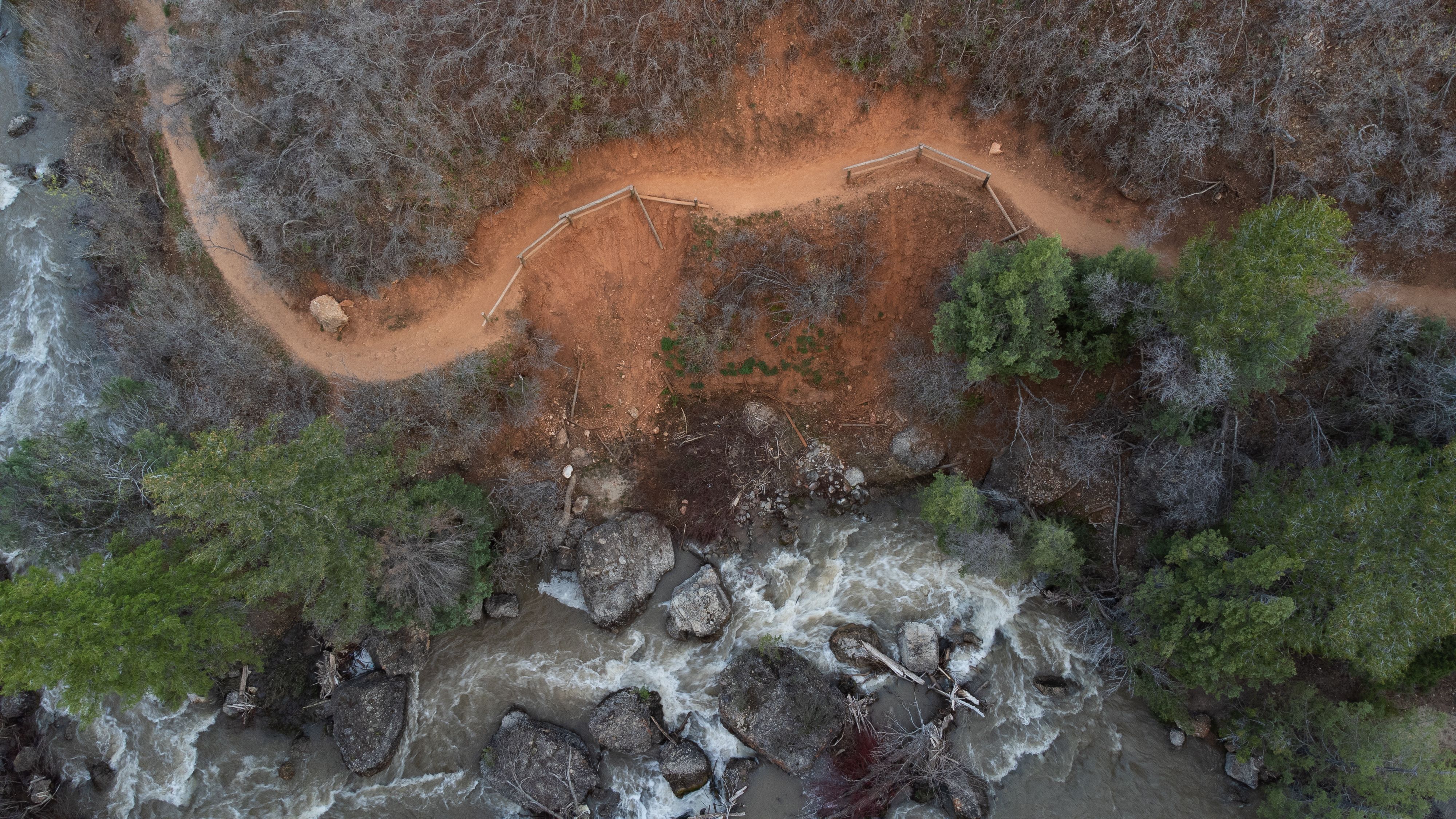Aerial View of a Riverside Trail · Free Stock Photo