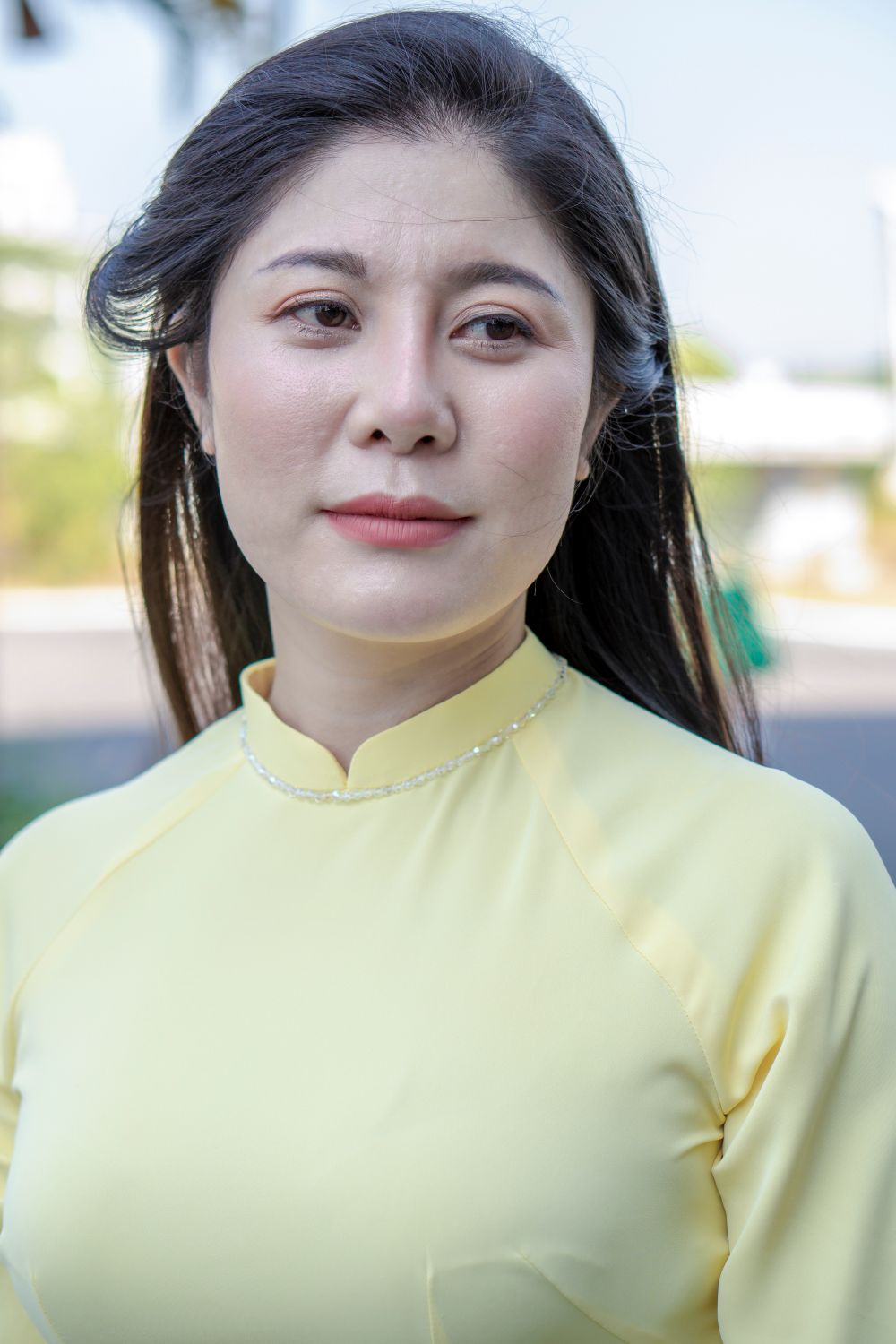 Portrait of an Asian Woman Wearing Yellow Dress · Free Stock Photo