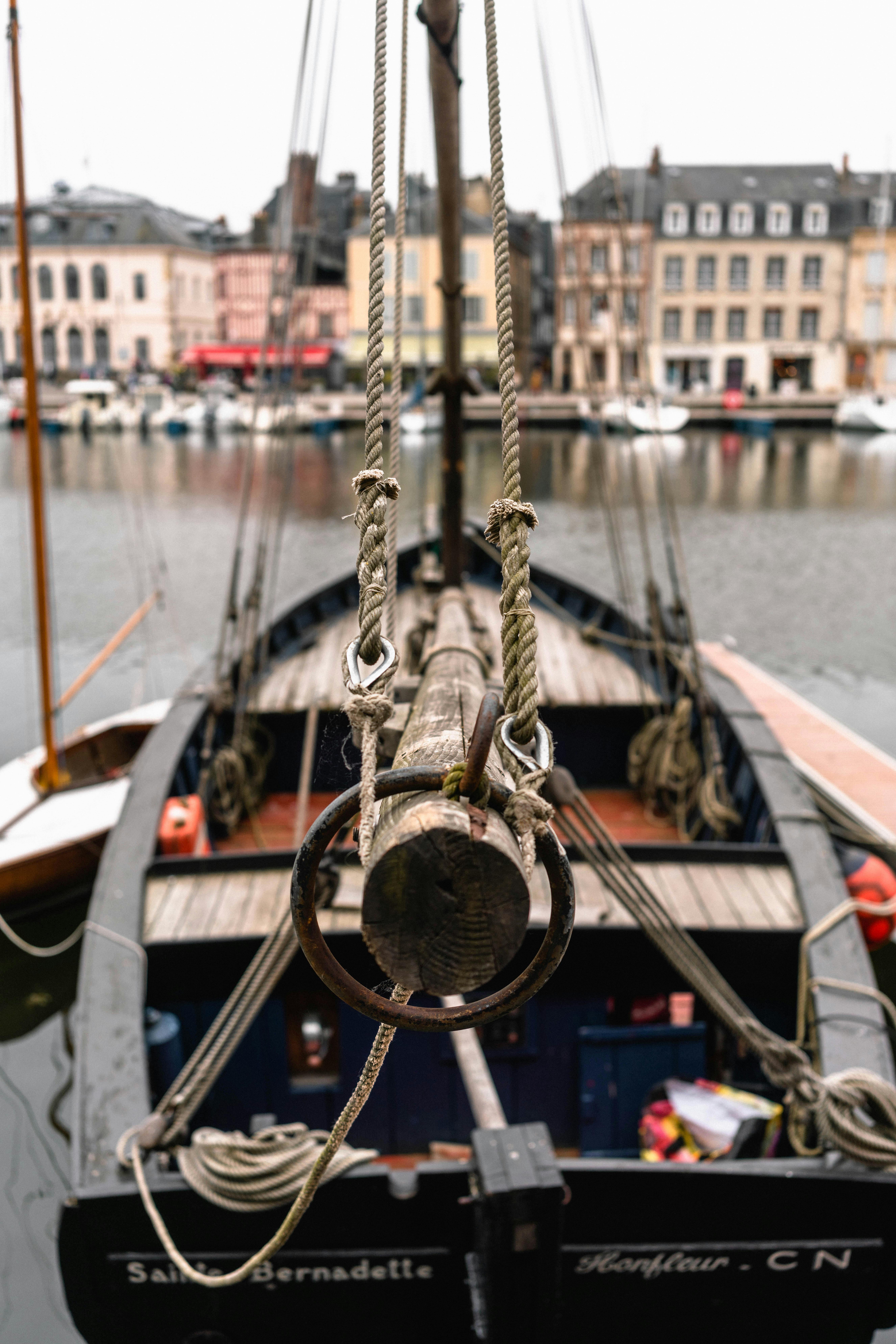 Man Navigating a Boat on Sea · Free Stock Photo