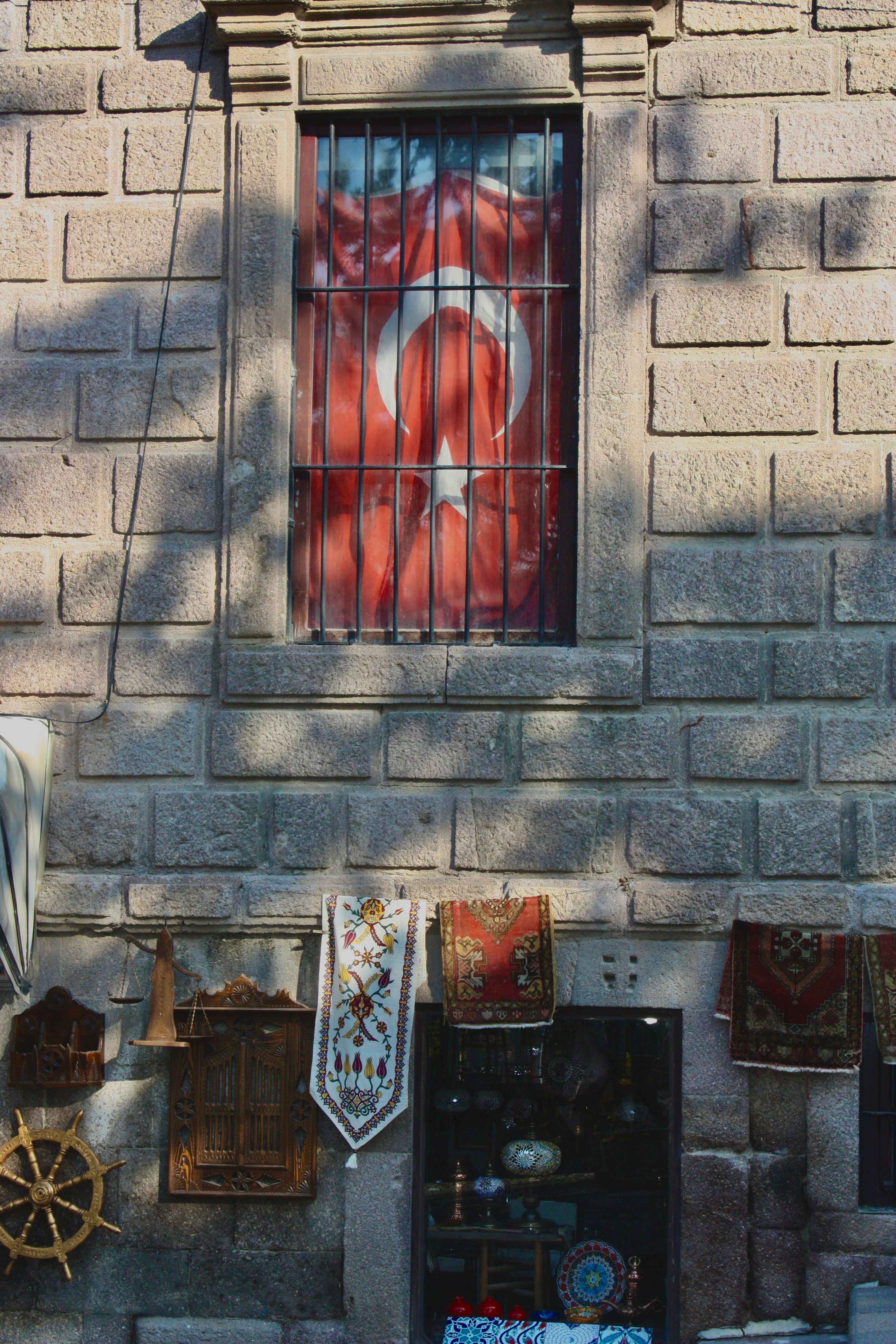 Street Antique Stall under Window with Turkish Flag · Free Stock Photo