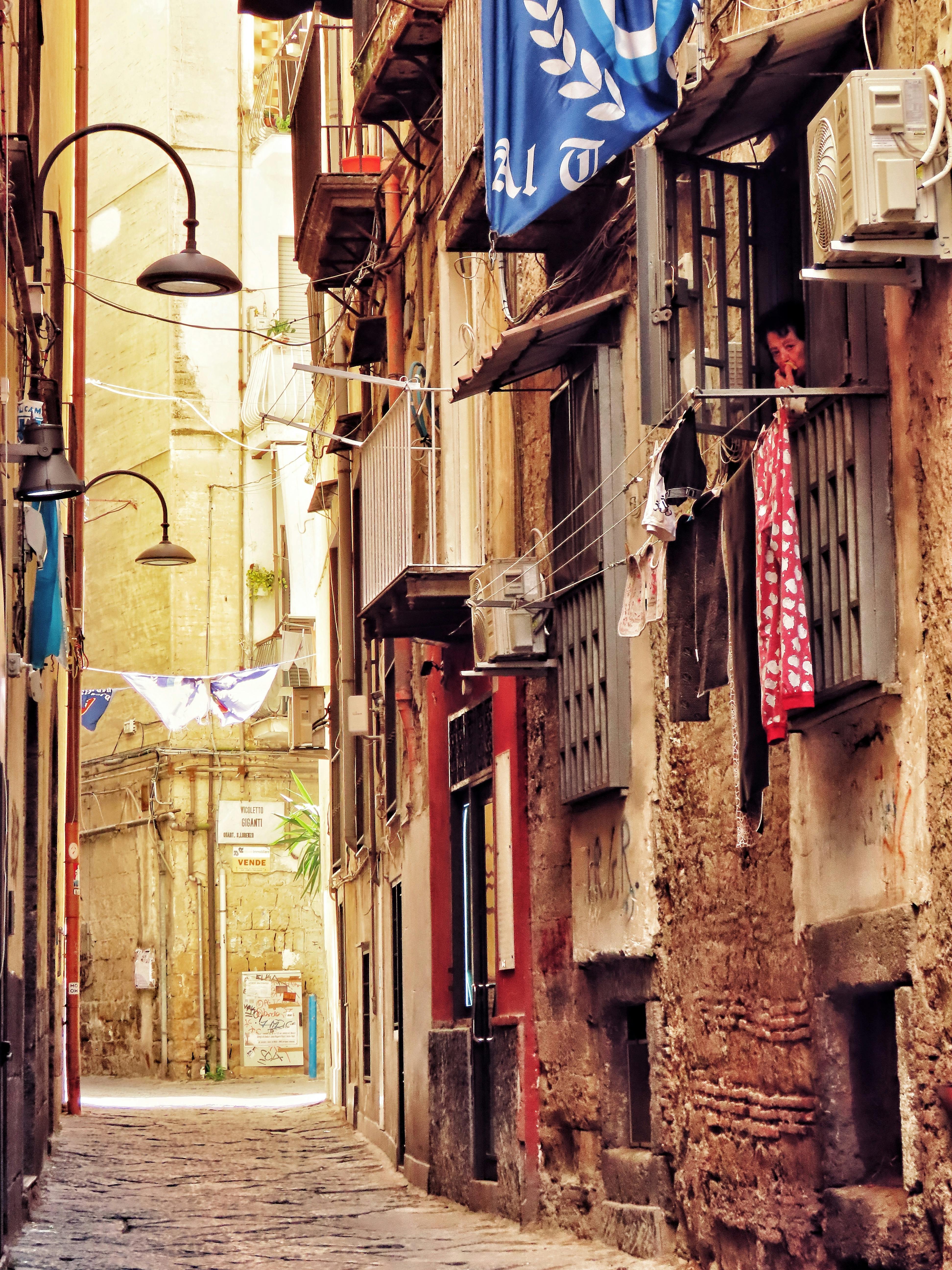 A Narrow Alley in Between Buildings · Free Stock Photo