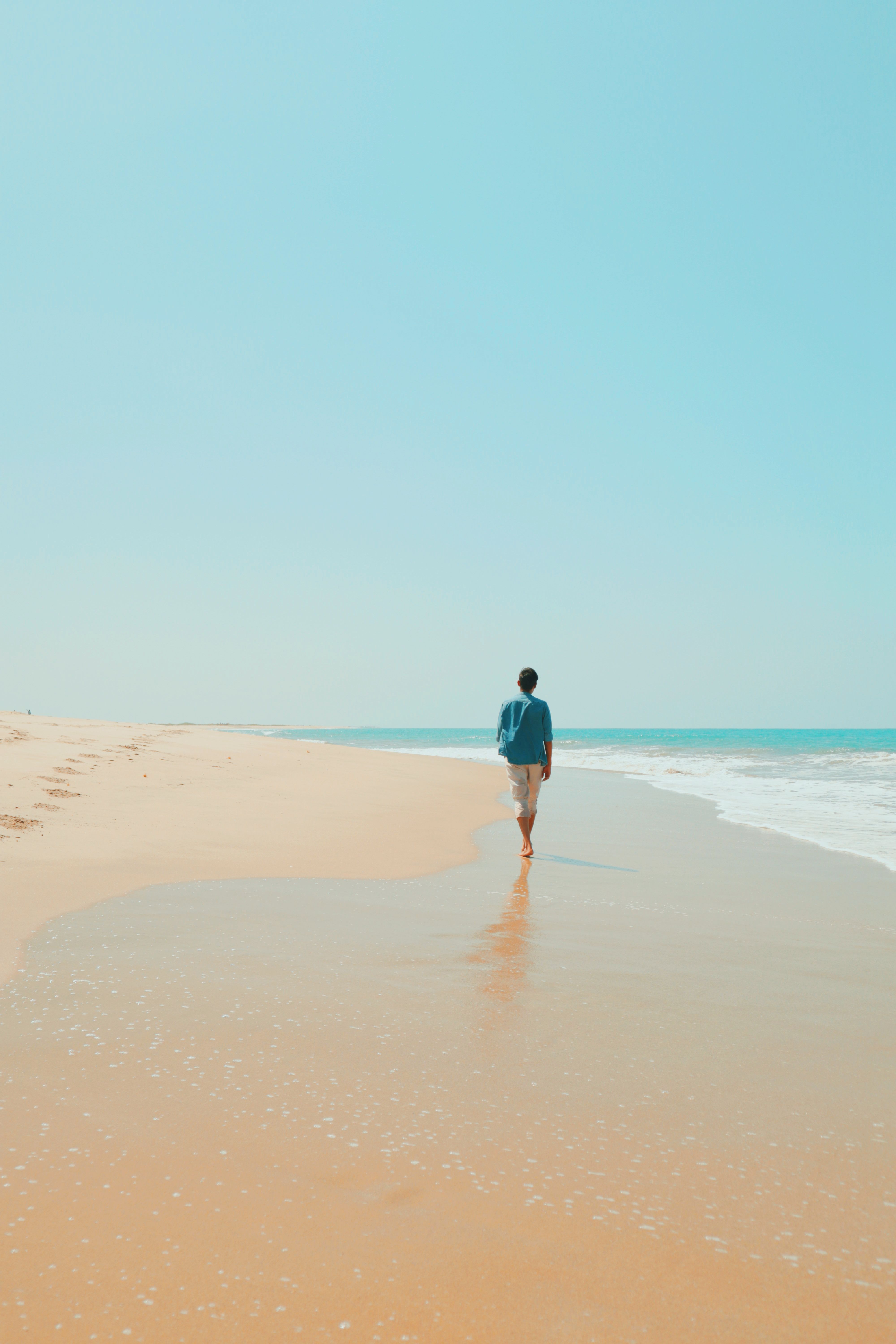 Man on a Stroll along Beach · Free Stock Photo