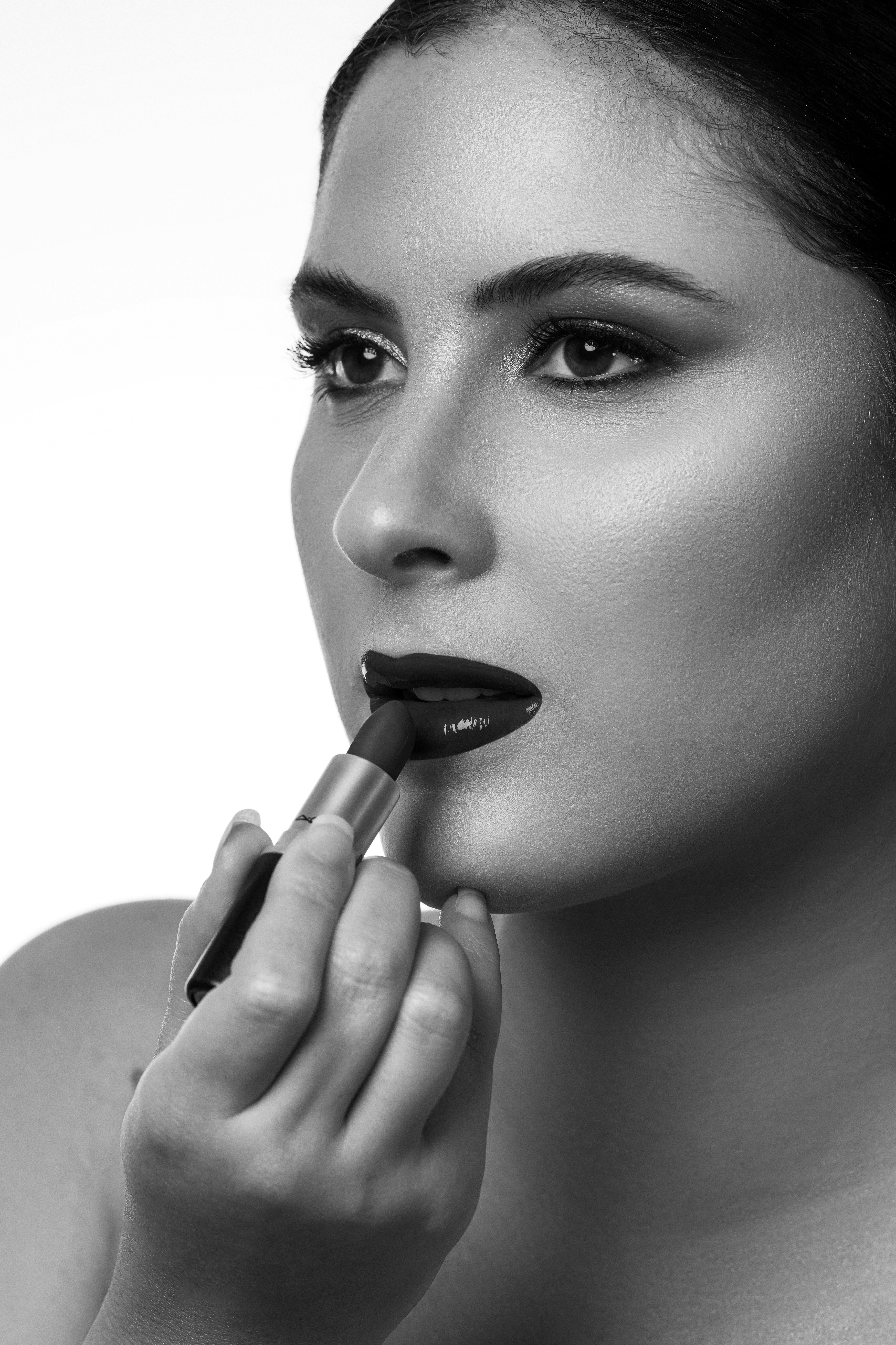 Woman Applying Lipstick · Free Stock Photo