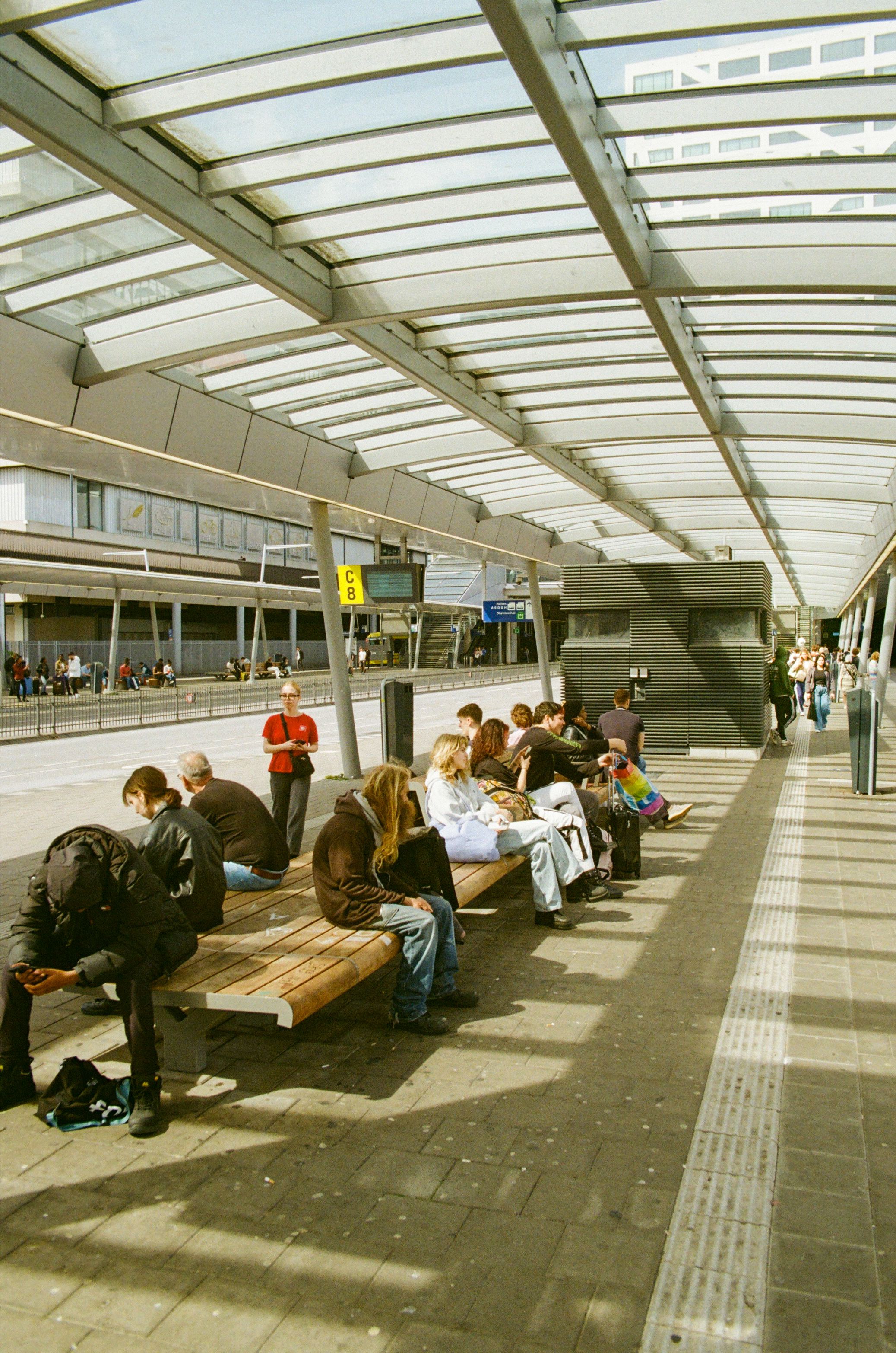 Commuters Waiting at Railway Station · Free Stock Photo