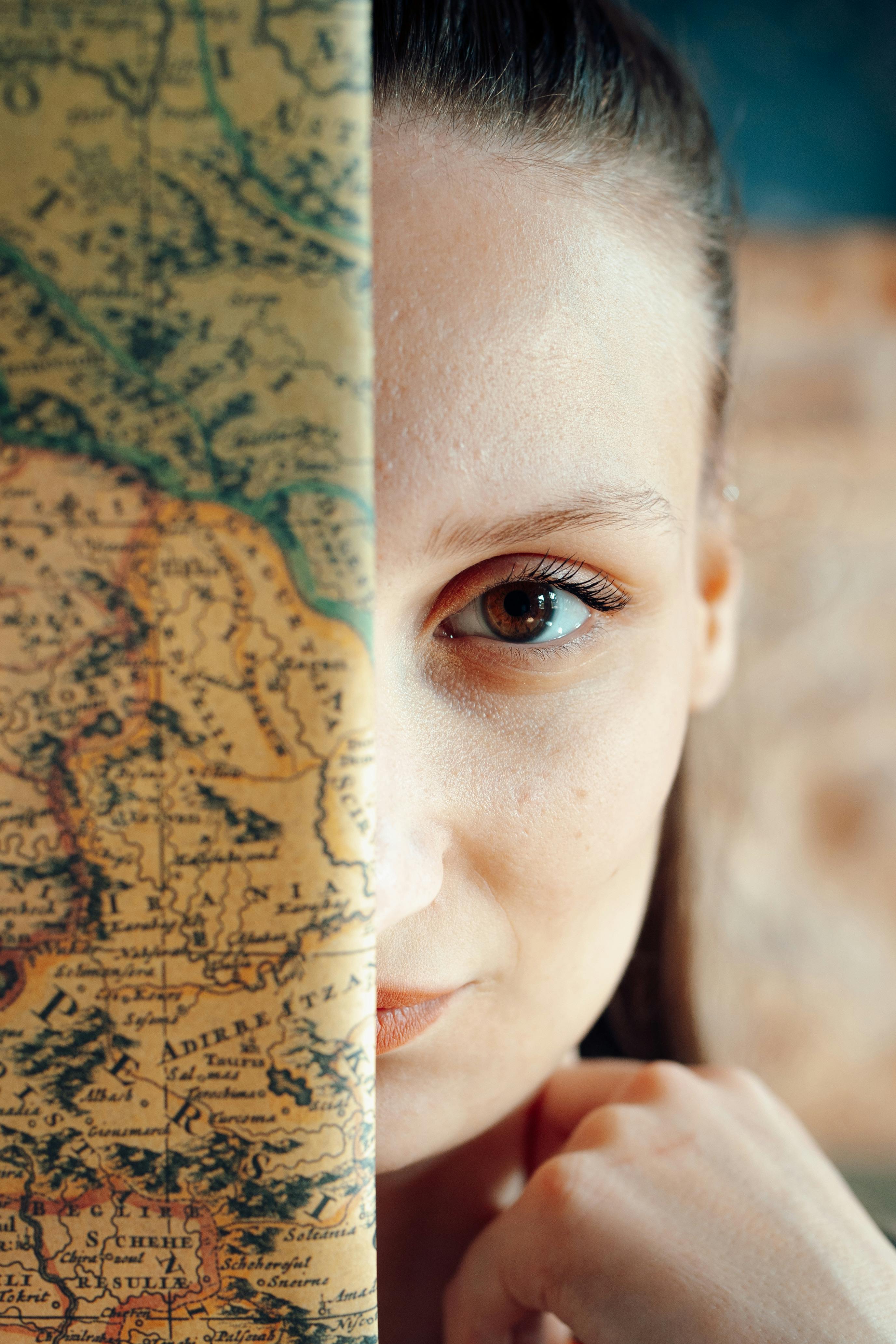 Woman Face behind Map · Free Stock Photo