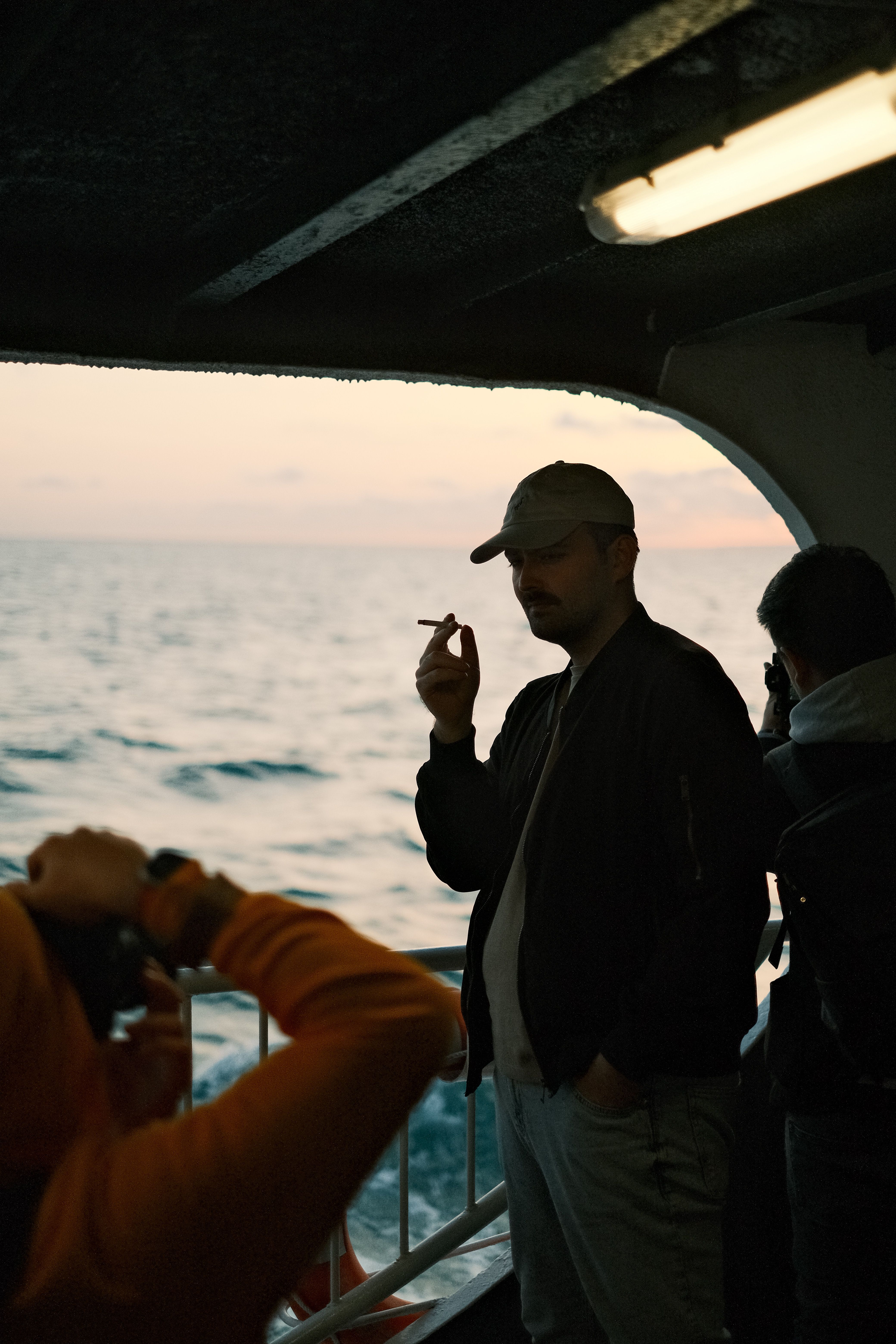 Photographed Ferry Passenger Smoking a Cigarette · Free Stock Photo