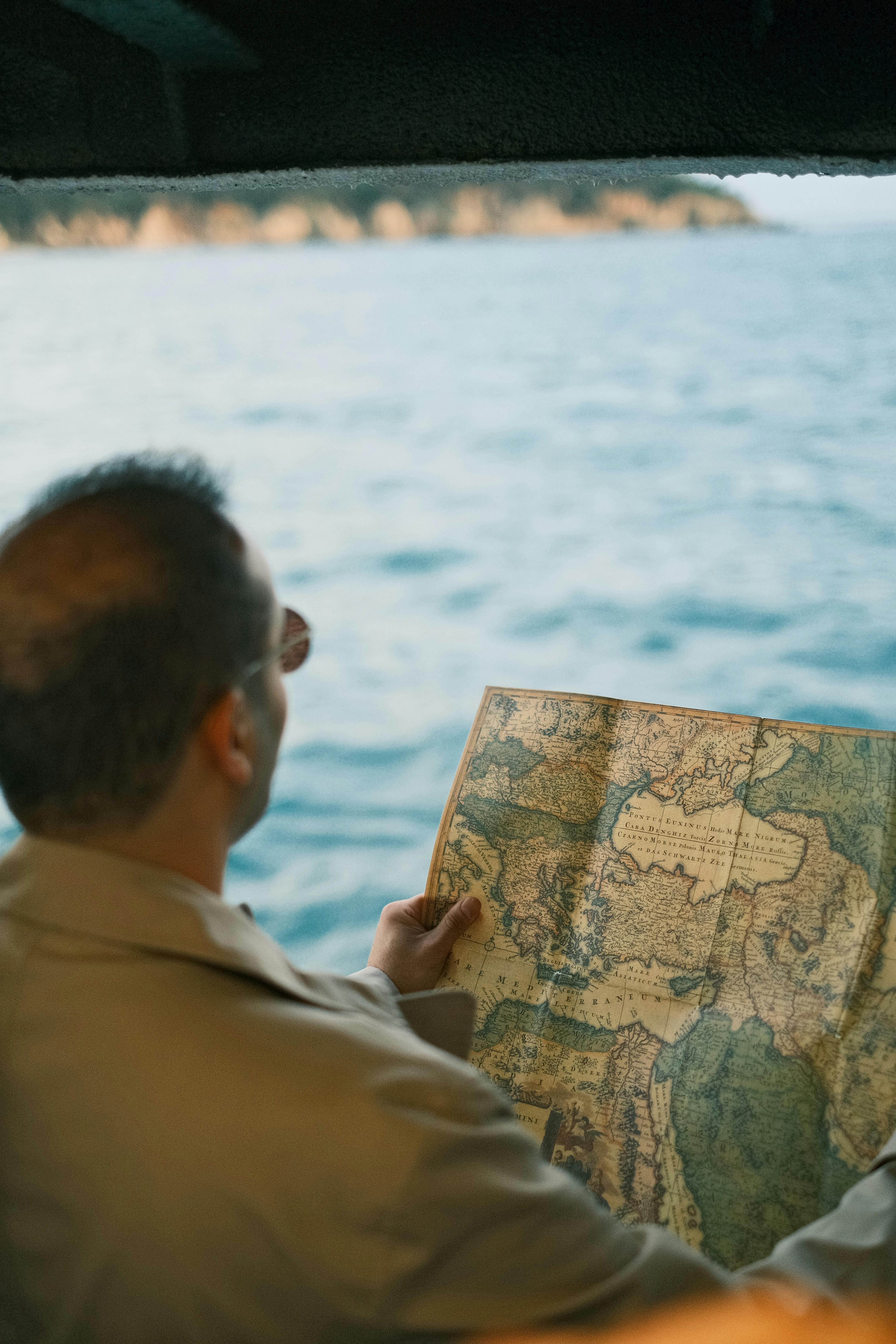 A Man Holding a Map · Free Stock Photo