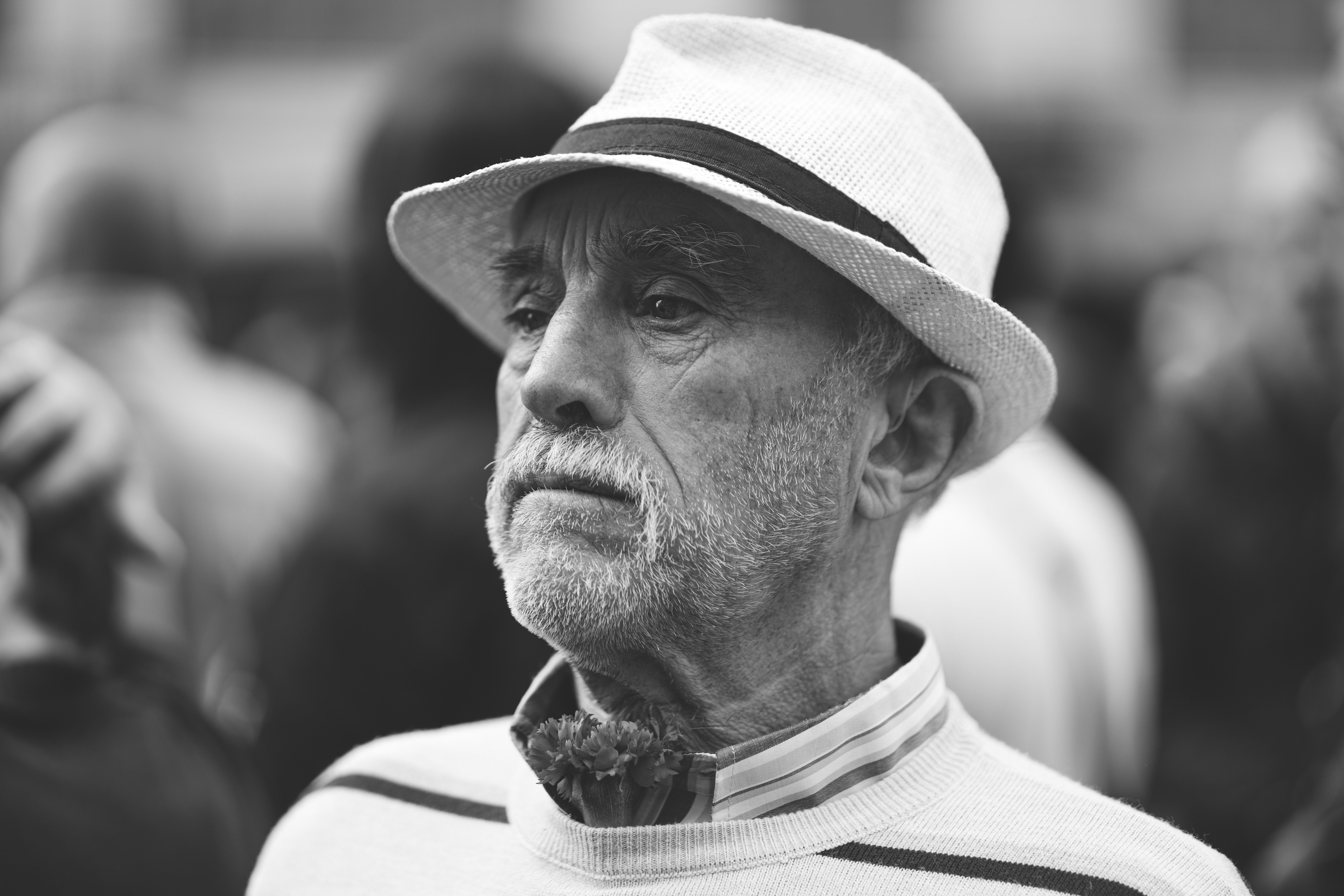 Candid Portrait of an Elderly Man Standing among the Crowd · Free Stock ...