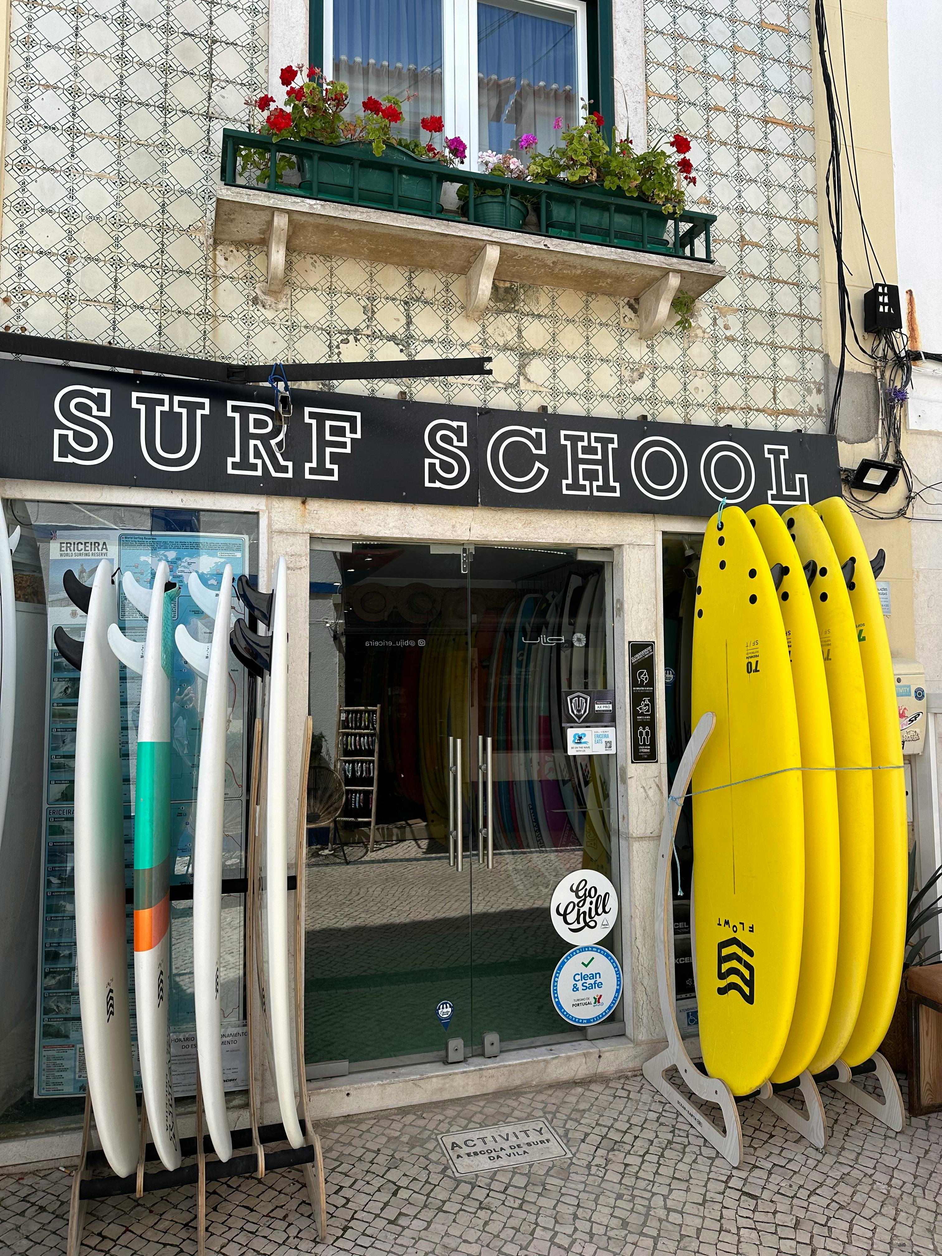 Surfboards in Front of a Surf School · Free Stock Photo