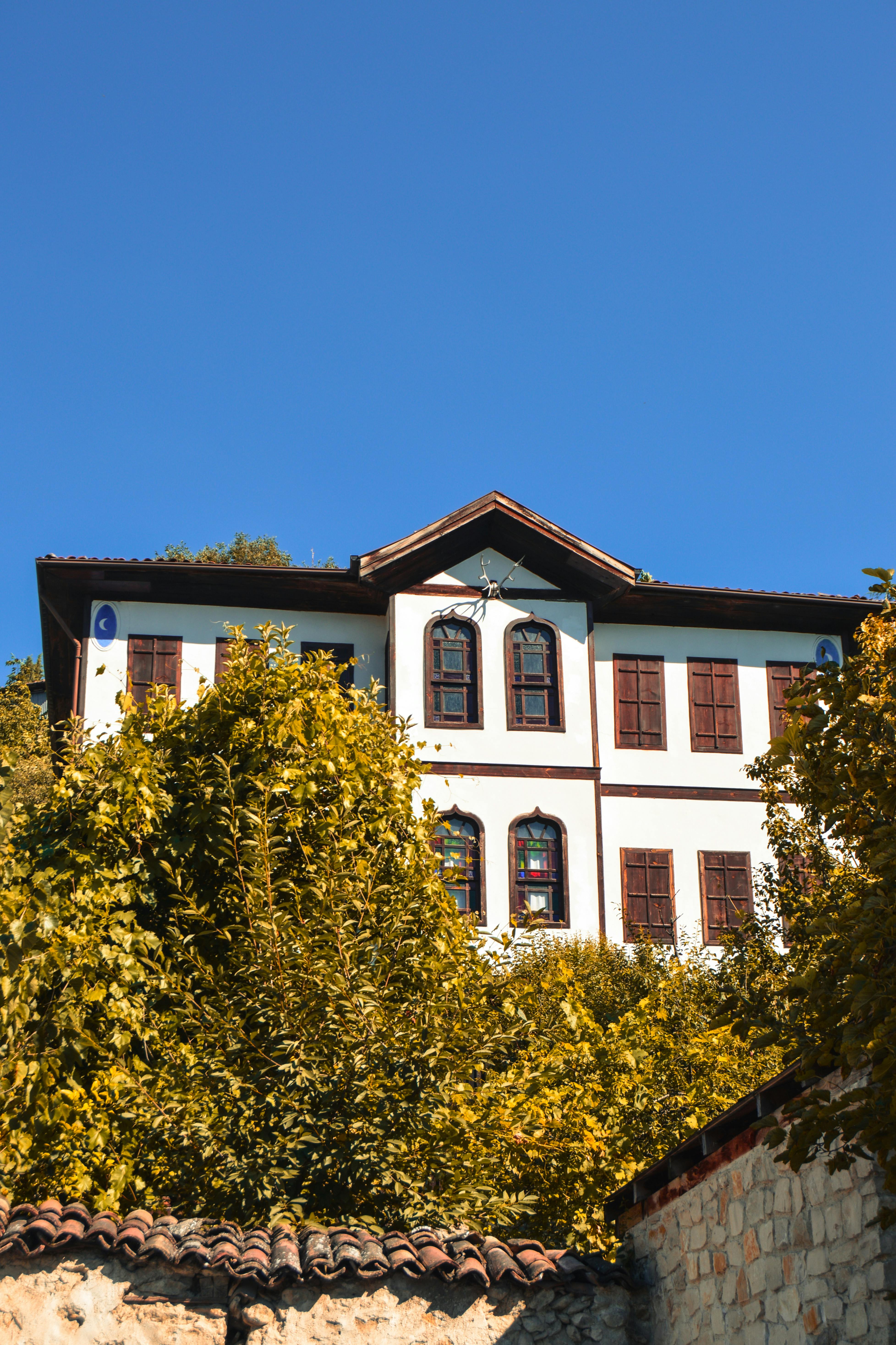 Low Angle Shot of a Residential Building under a Clear, Blue Sky · Free ...