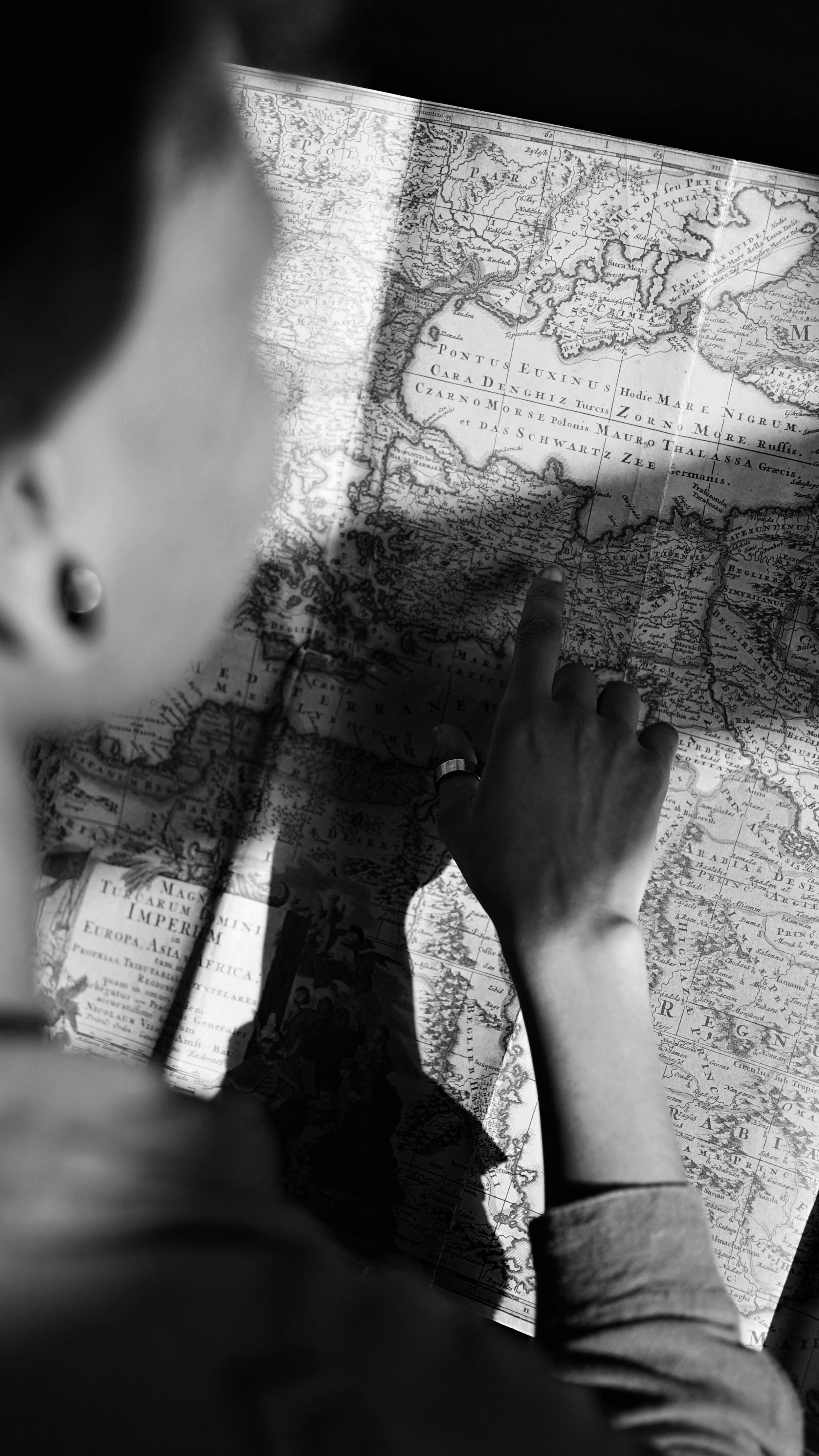 Woman Holding Hand on Map · Free Stock Photo