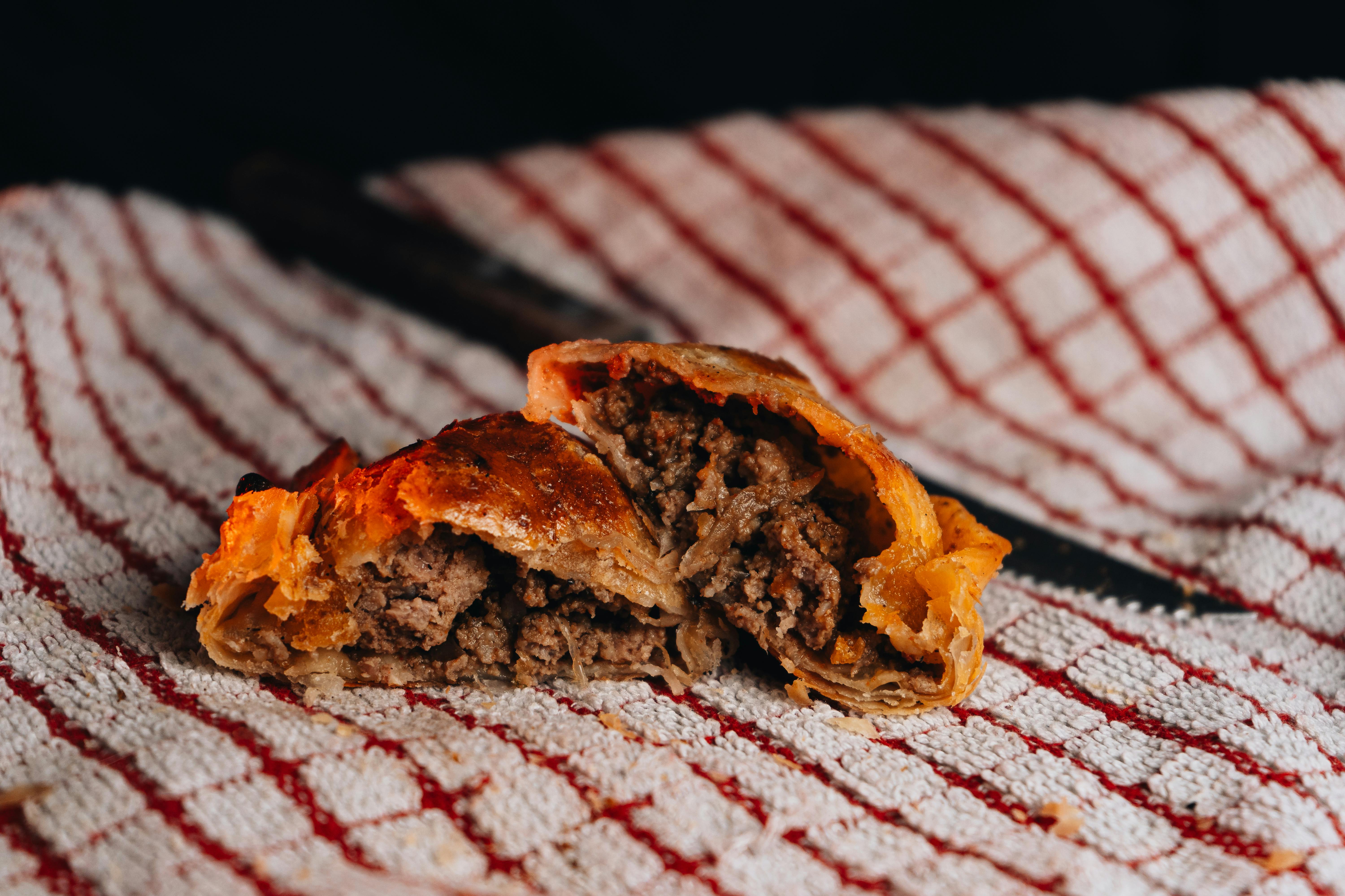 Close-up of a Cut in Half Empanada with Meat Filling · Free Stock Photo