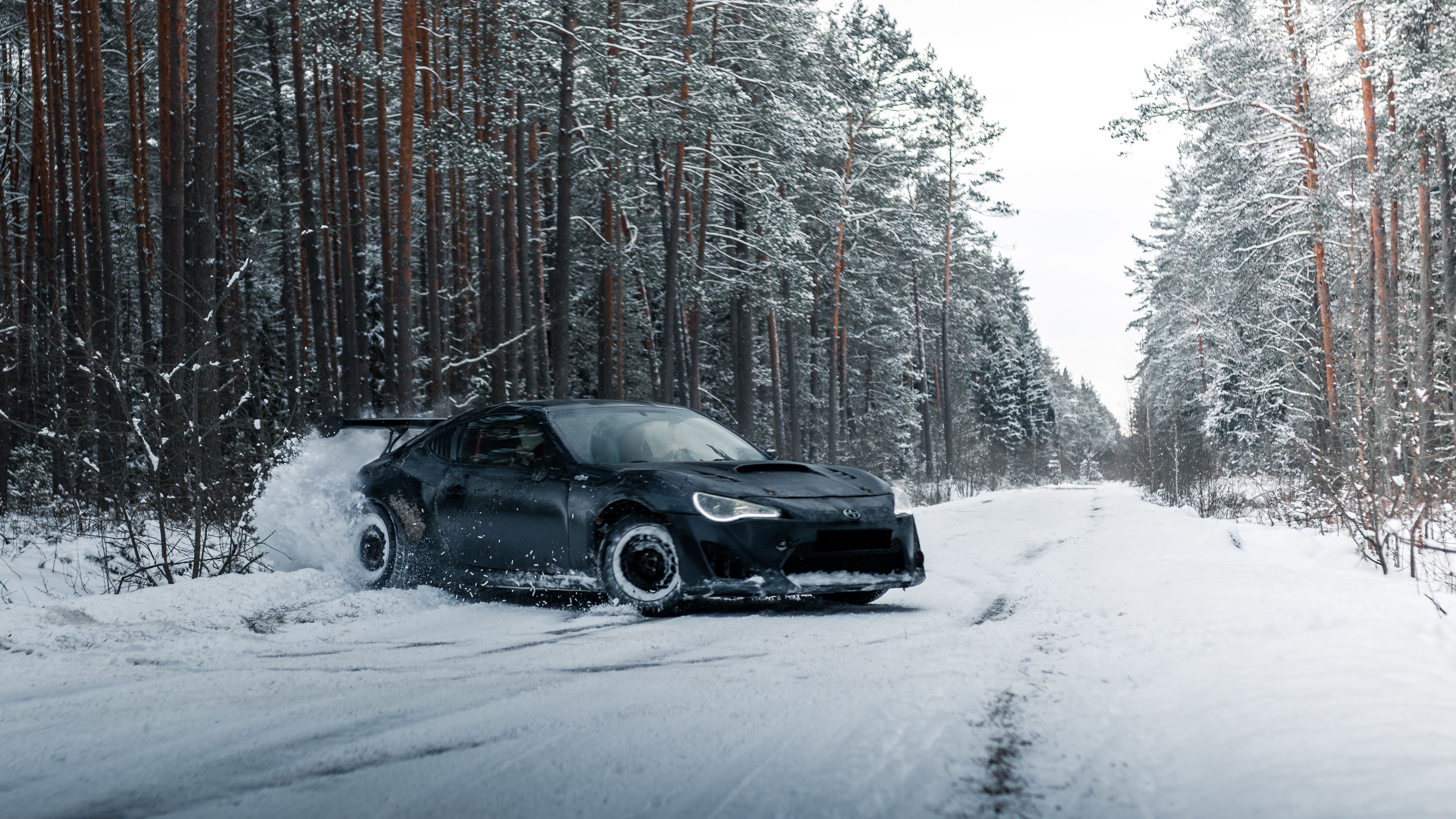Sports Car Drifting in Forest in Winter · Free Stock Photo