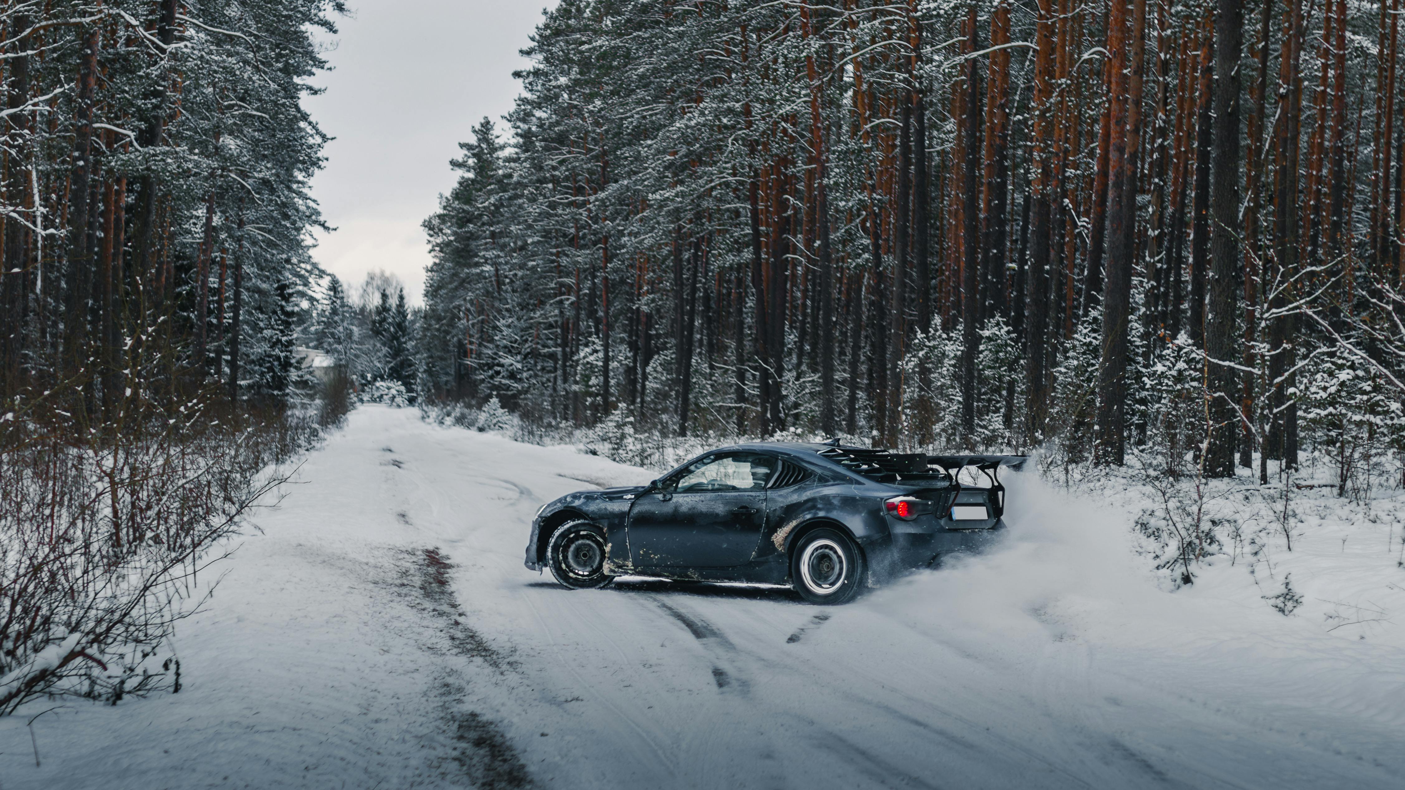 Toyota GT86 Drifting on Dirt Road in Forest in Winter · Free Stock Photo