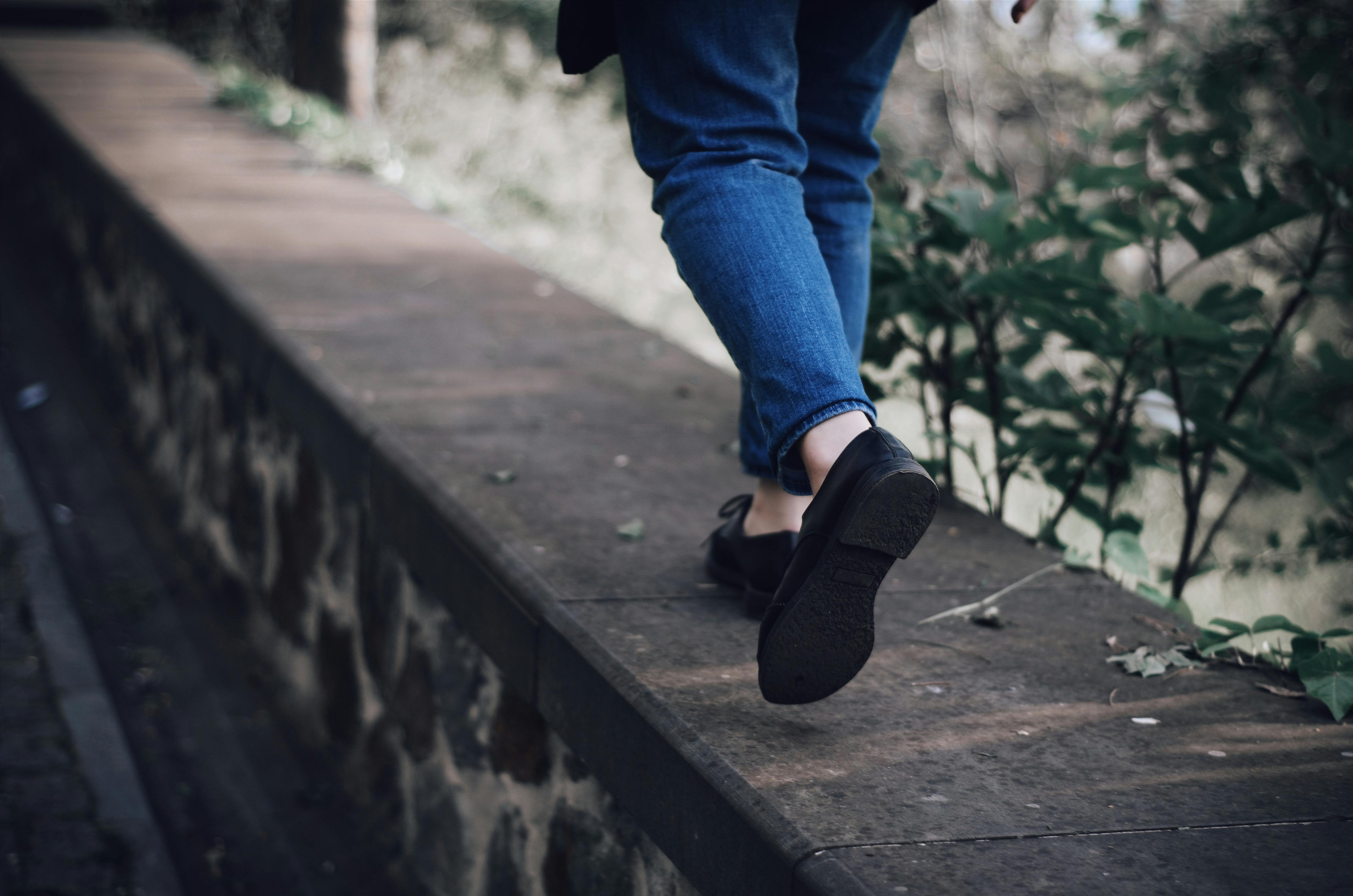 Person Walking on Footpath · Free Stock Photo