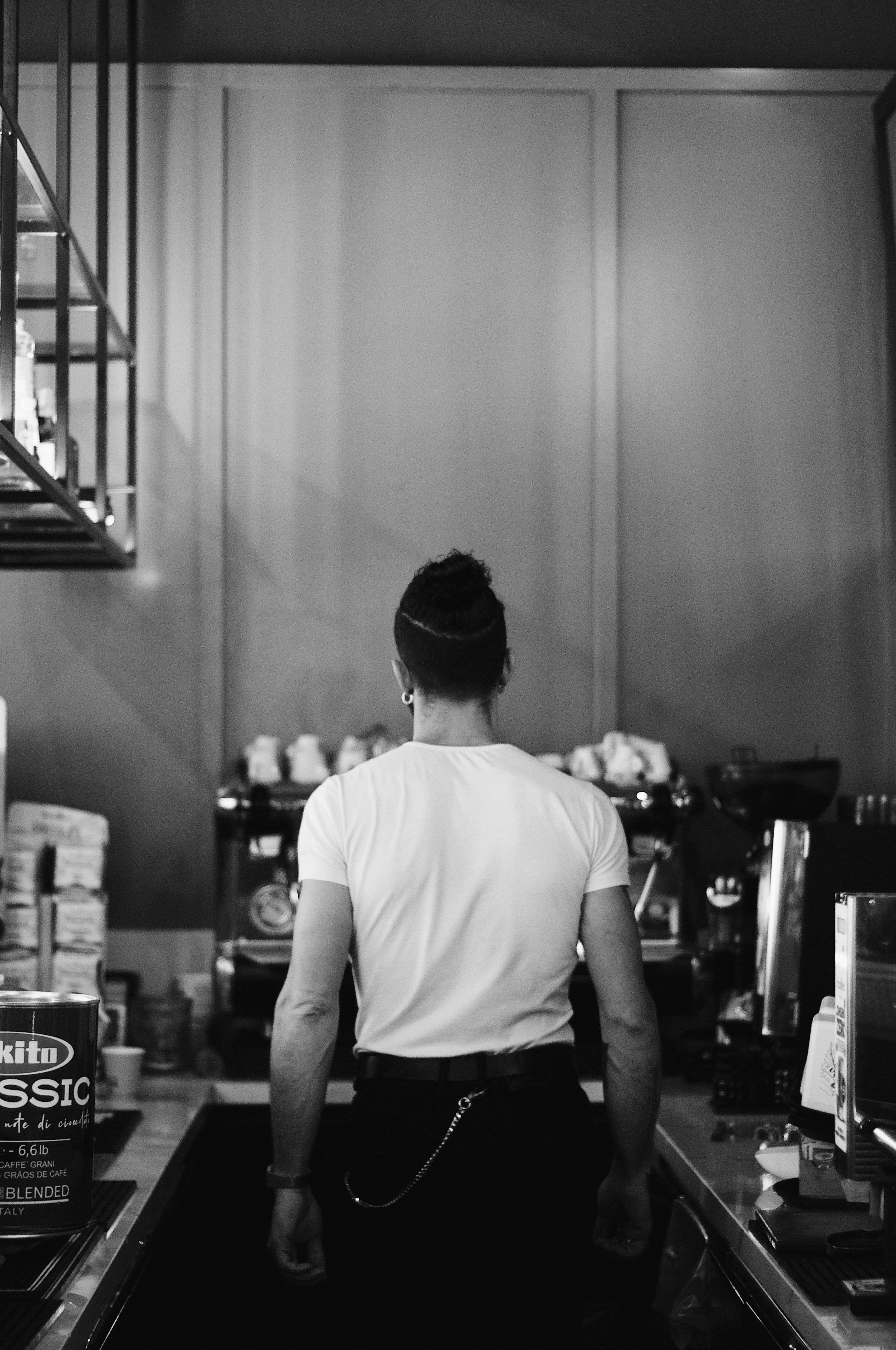 Back of a Male Barista Working in a Cafe · Free Stock Photo