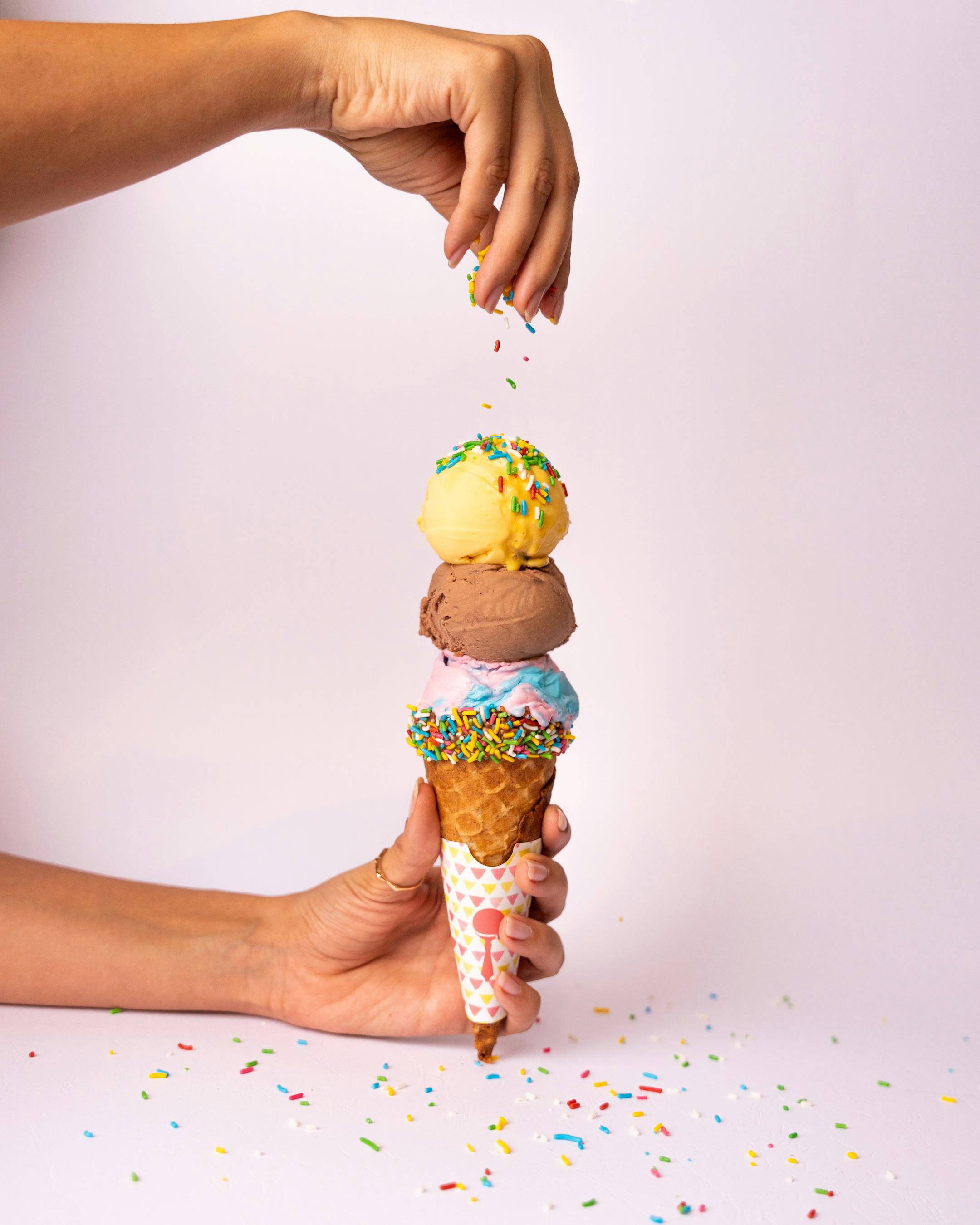Hand Sprinkling Ice Cream · Free Stock Photo